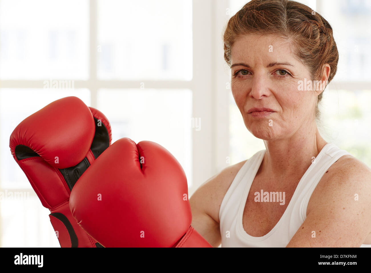 Germany, Duesseldorf, Portrait of mature woman with boxing gloves Stock ...