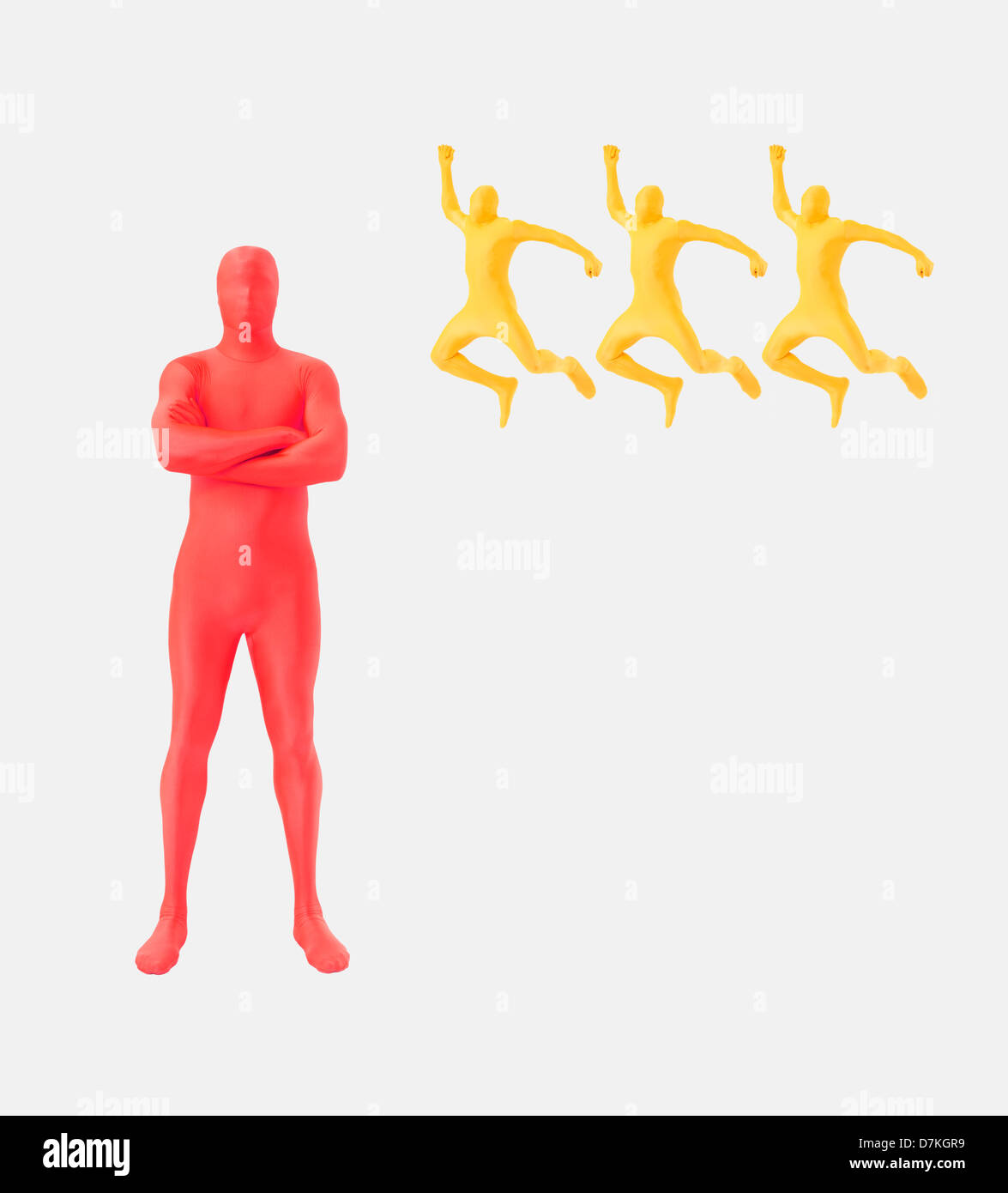 Man standing with red zentai while three men jumping in background ...