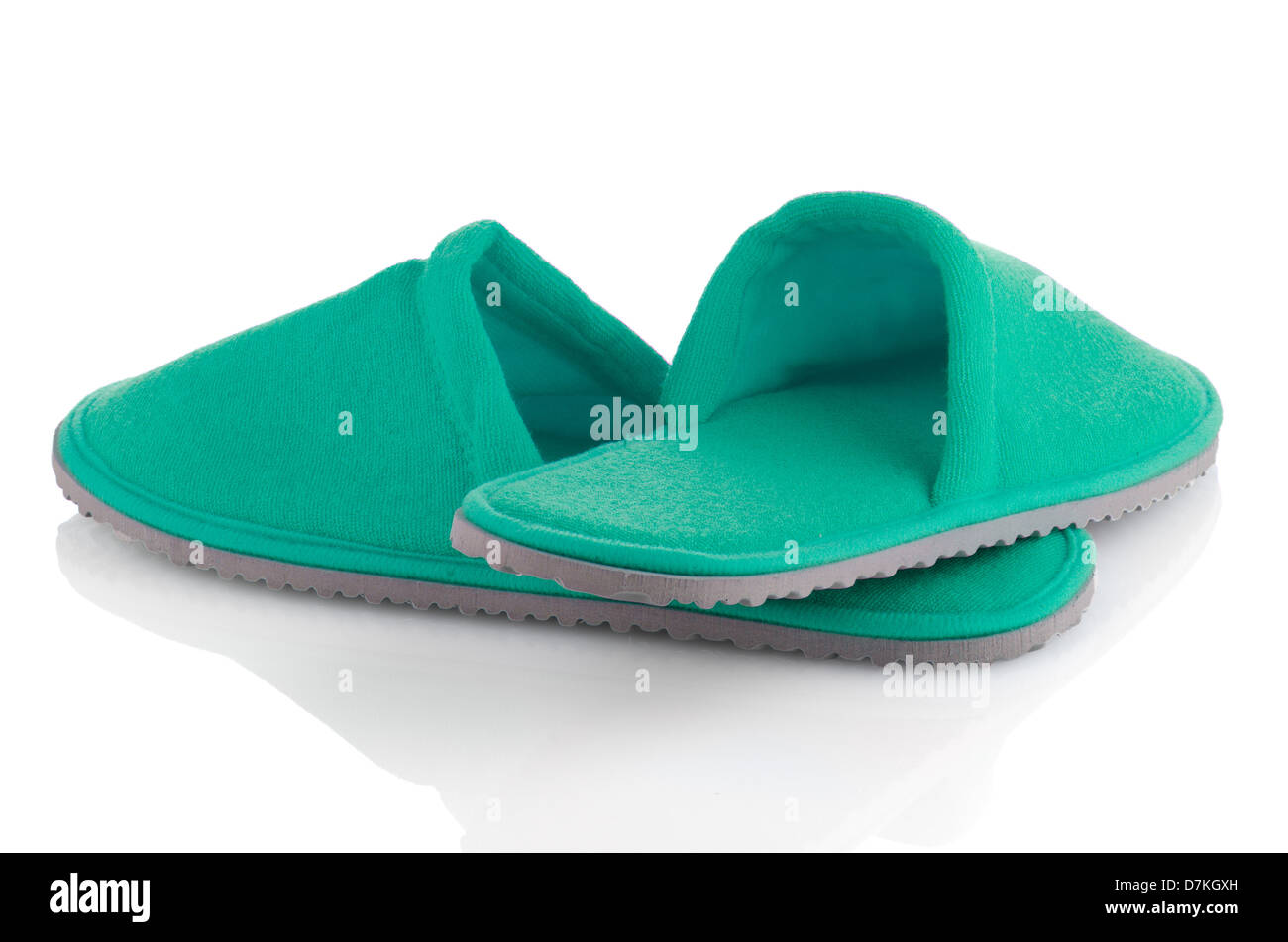 A pair of green slippers on a white background Stock Photo - Alamy