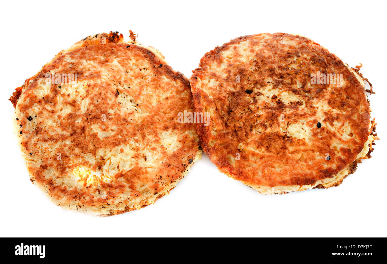 potato rosti cake in front of white background Stock Photo - Alamy