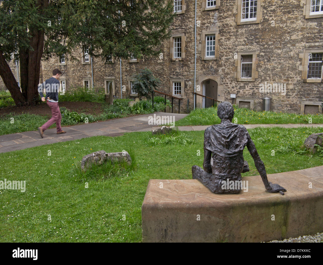 Student at the garden of St. Edmund Hall college at Oxford University ...
