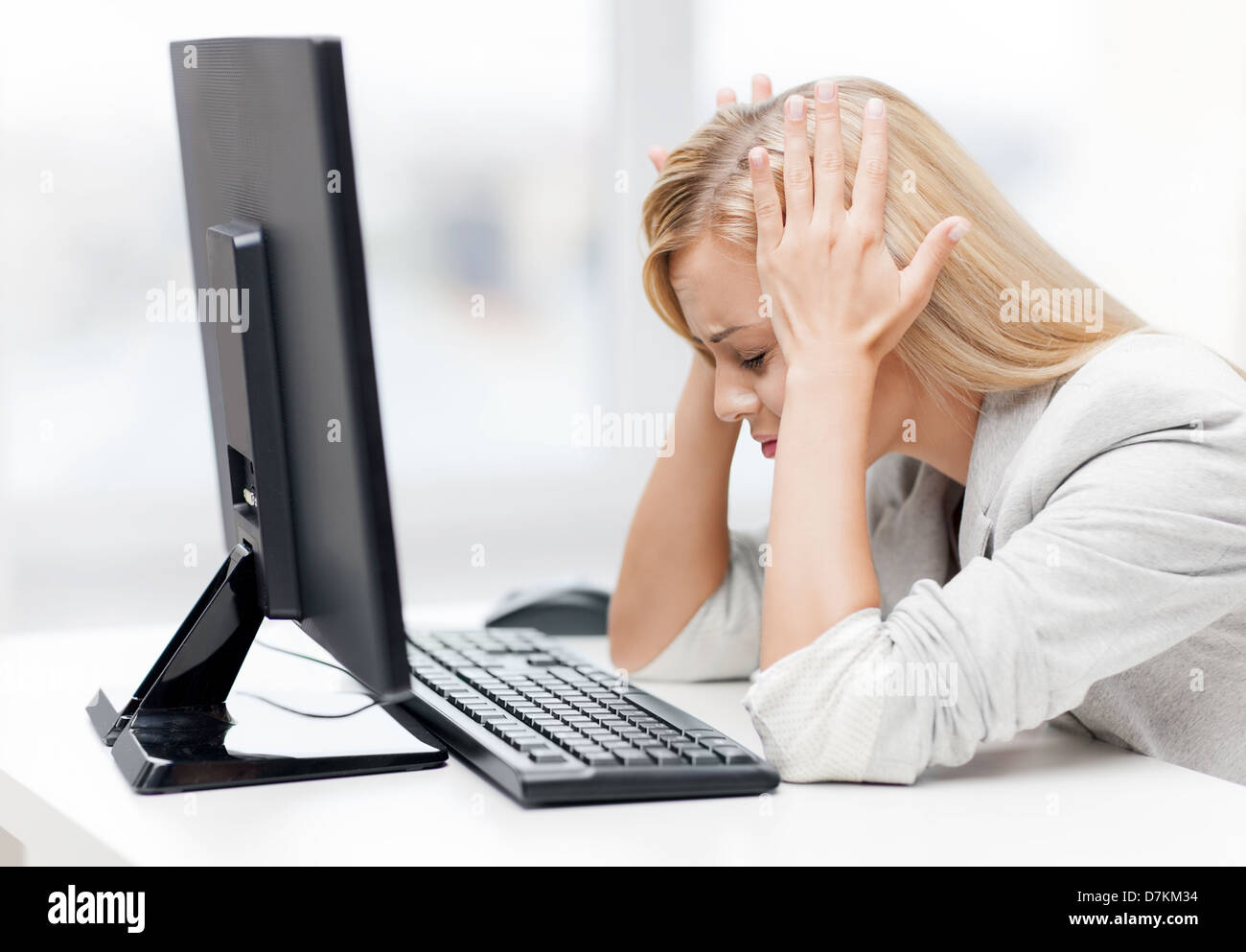 stressed woman with computer Stock Photo - Alamy
