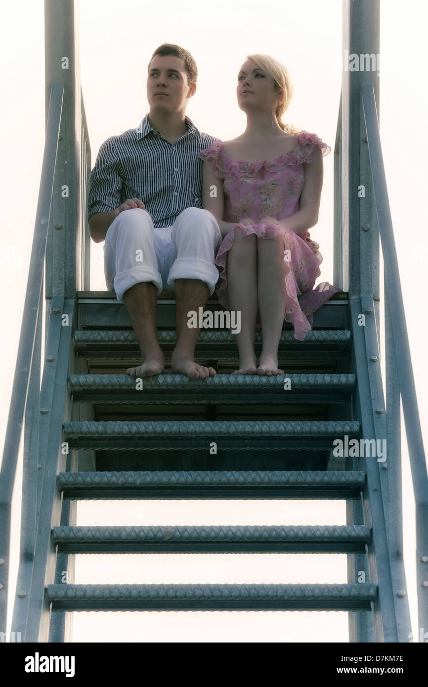 a couple sitting on steps Stock Photo - Alamy