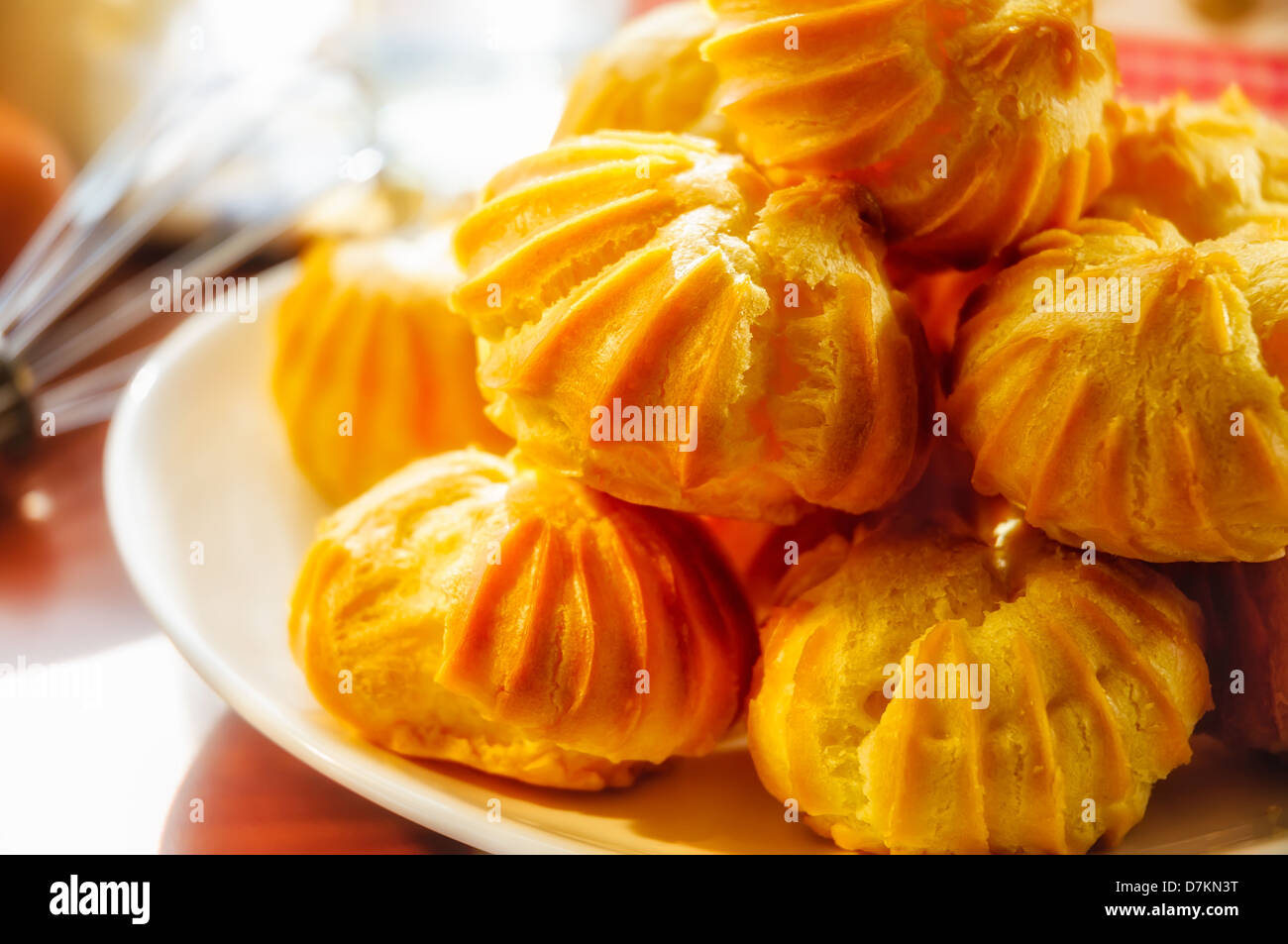 Close-up of puffs in a plate, morning light Stock Photo - Alamy
