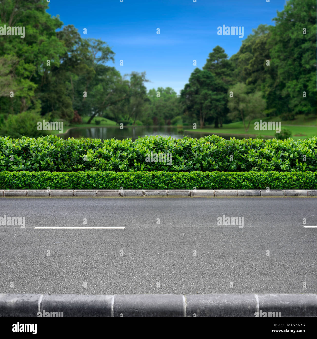 Roadside view of beautiful park on blue sky Stock Photo - Alamy