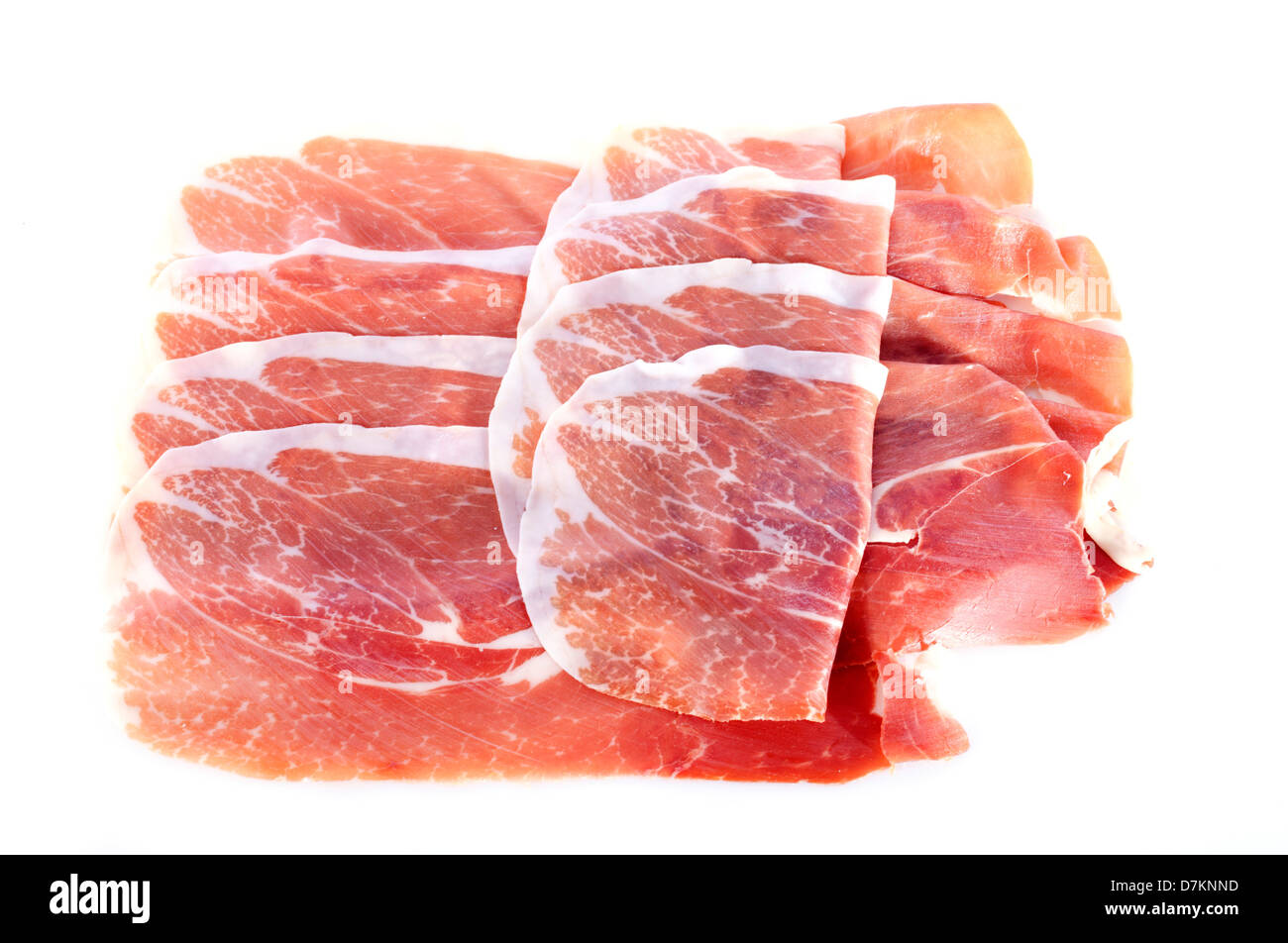 slice of raw ham in front of white background Stock Photo - Alamy