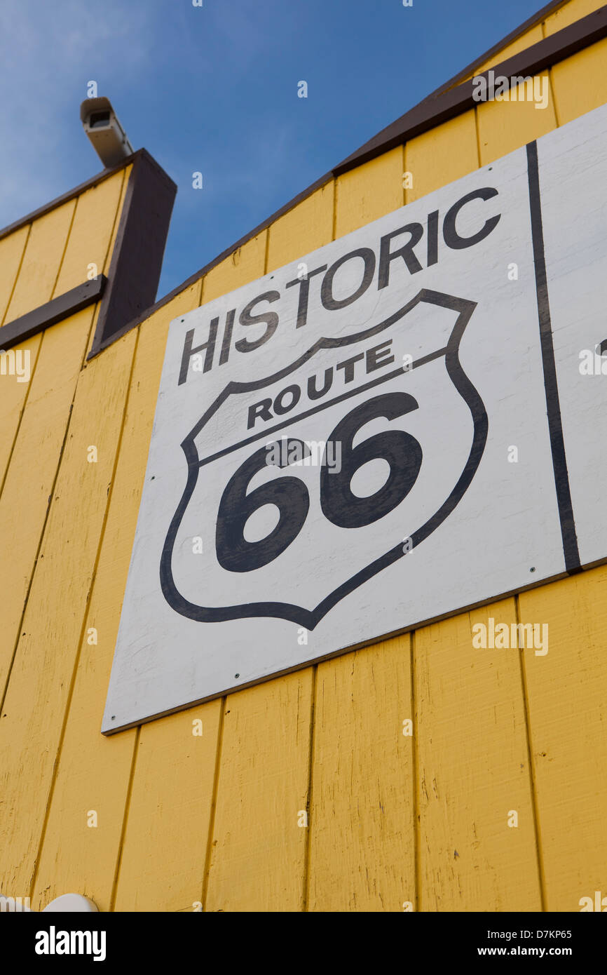 A Historic Route 66 sign on a wooden wall, USA Stock Photo - Alamy