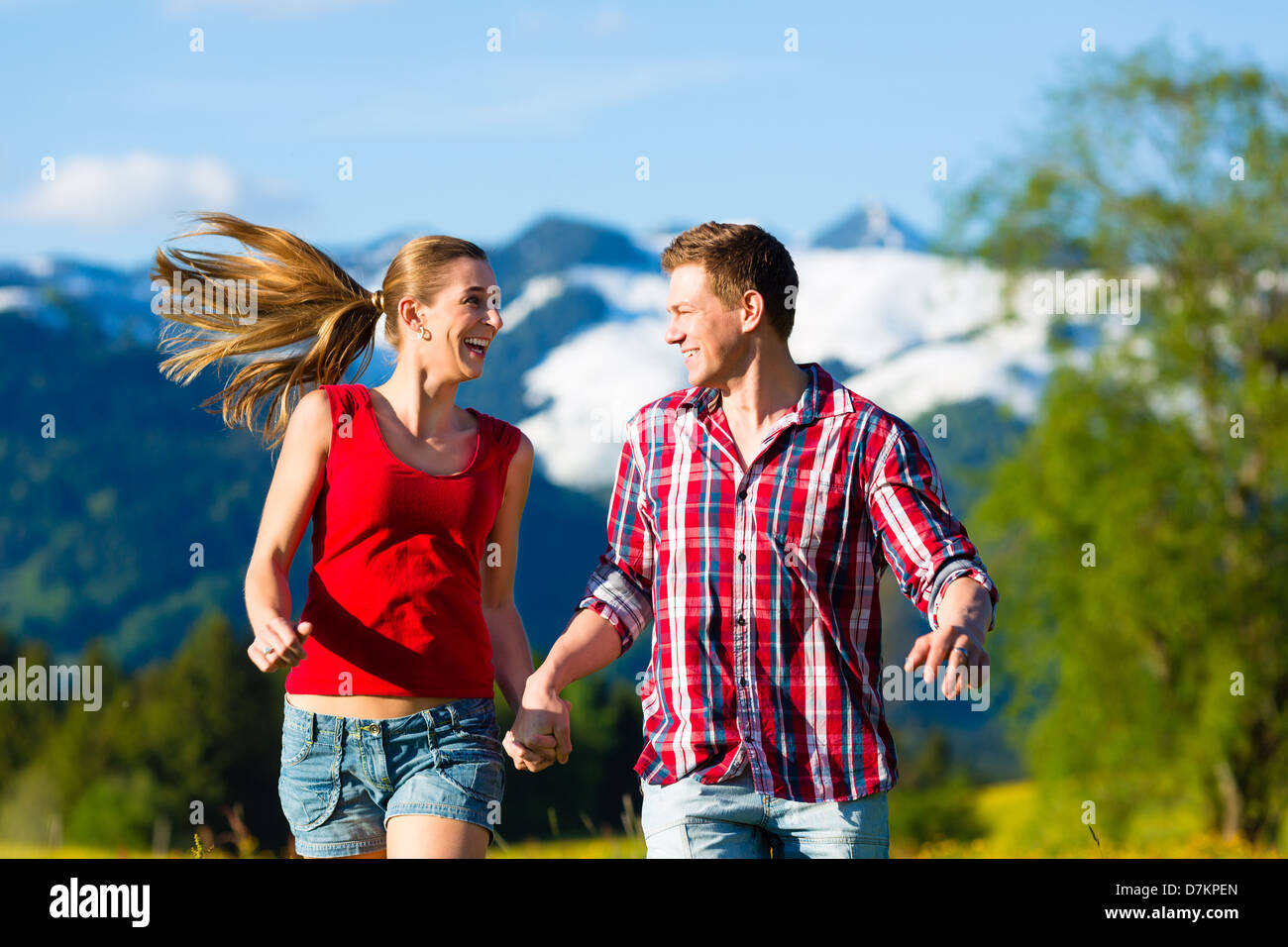 Couple running mountains hi-res stock photography and images - Alamy