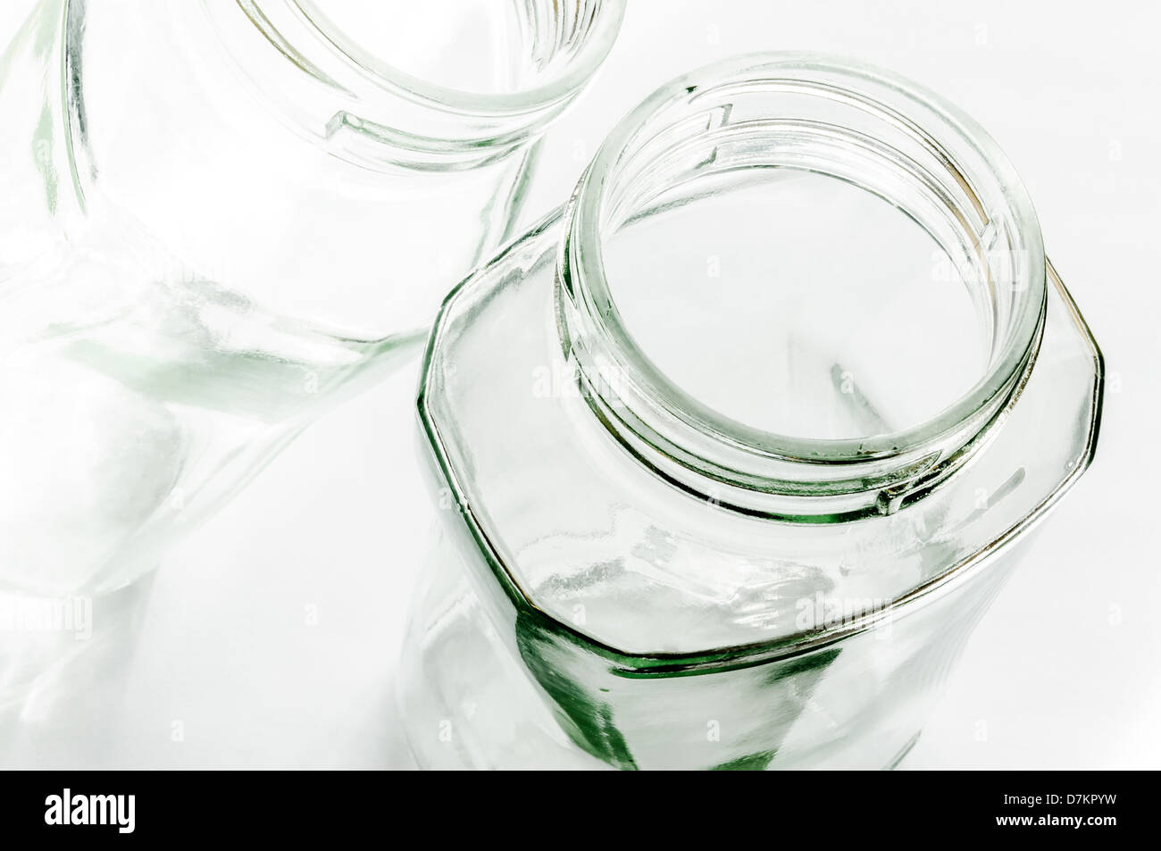 Transparent glass jars on white, with high-key effect Stock Photo - Alamy