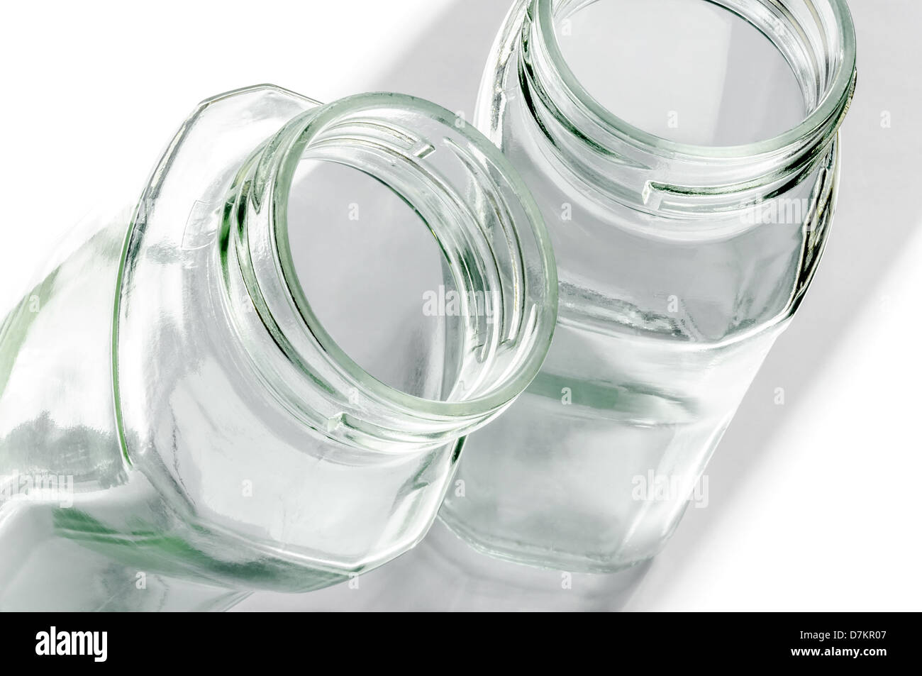 Transparent glass jars on white, with high-key effect Stock Photo - Alamy