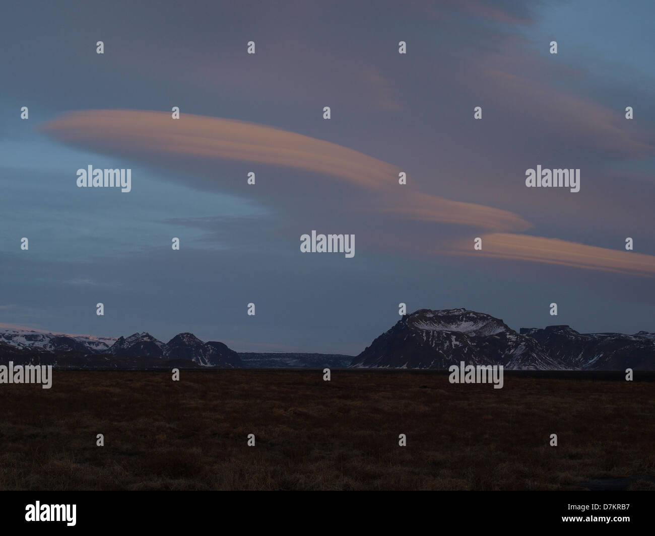 Lenticular clouds form over Icelandic mountains Stock Photo - Alamy