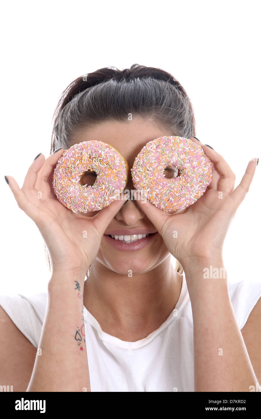 Model Released. Young Woman Holding Ring Donuts Stock Photo - Alamy