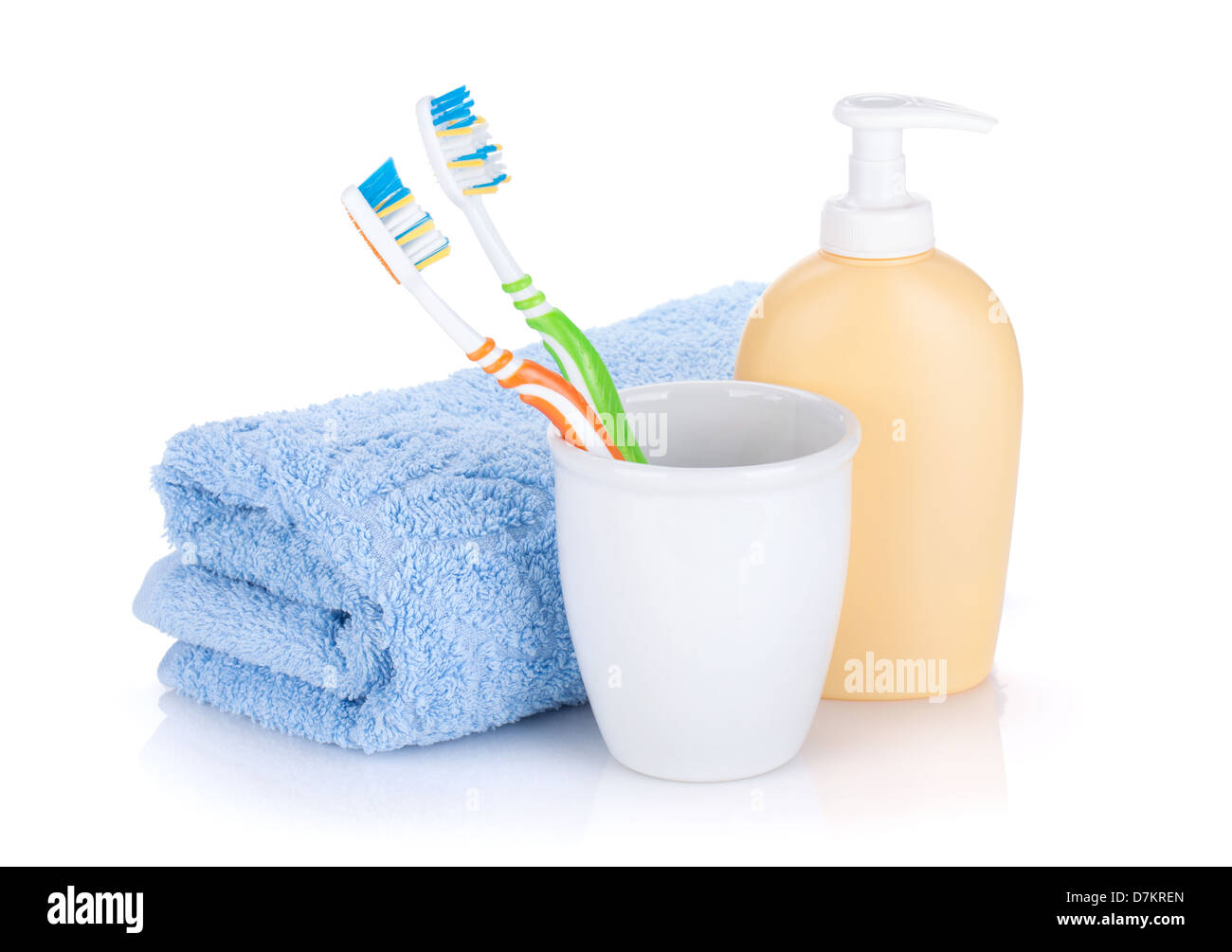 Two colorful toothbrushes, liquid soap and towel. Isolated on white ...