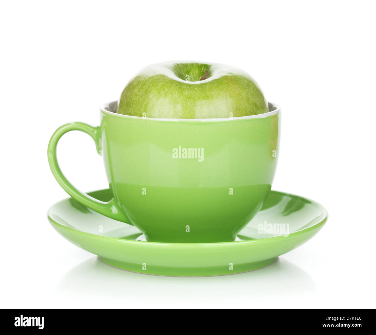Ripe green apple in tea cup. Isolated on white background Stock Photo ...