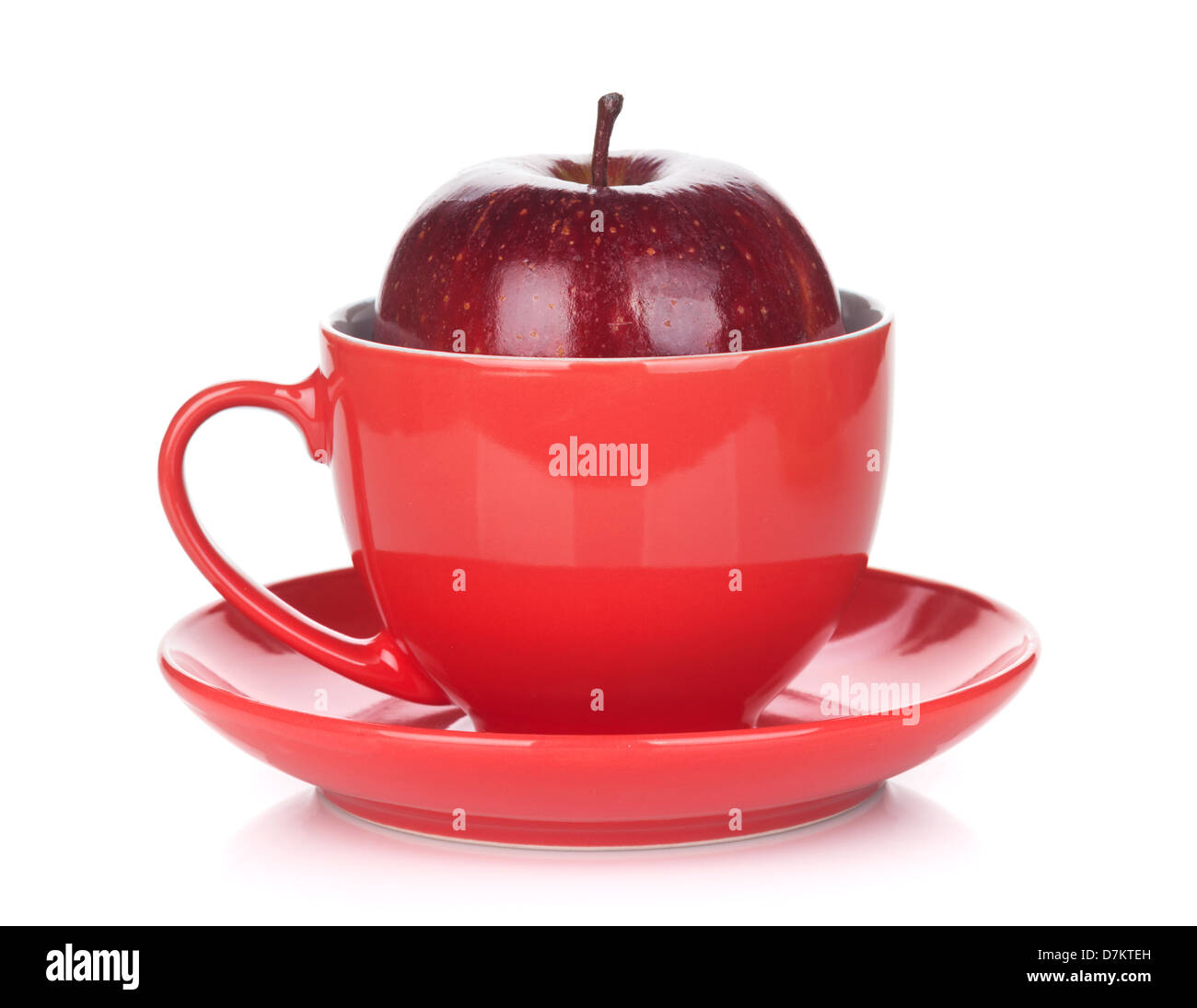 Ripe red apple in tea cup. Isolated on white background Stock Photo - Alamy