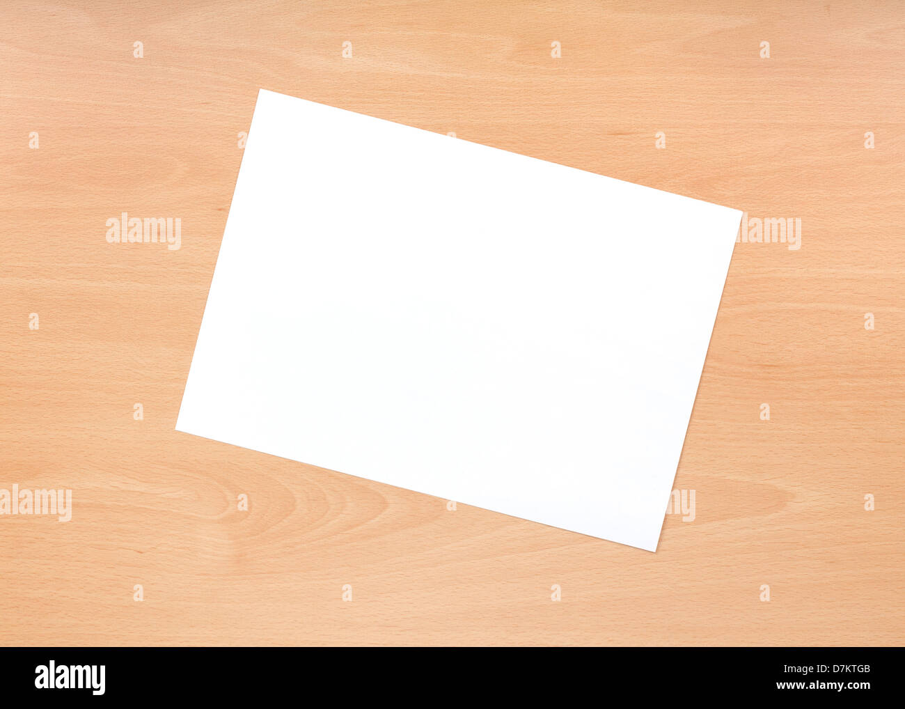 Blank paper on wood table Stock Photo - Alamy
