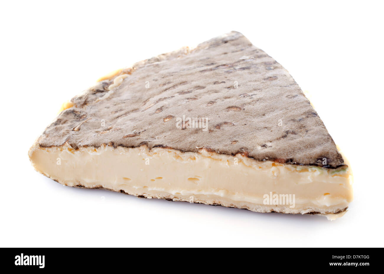 old Saint-Nectaire cheese in front of white background Stock Photo - Alamy