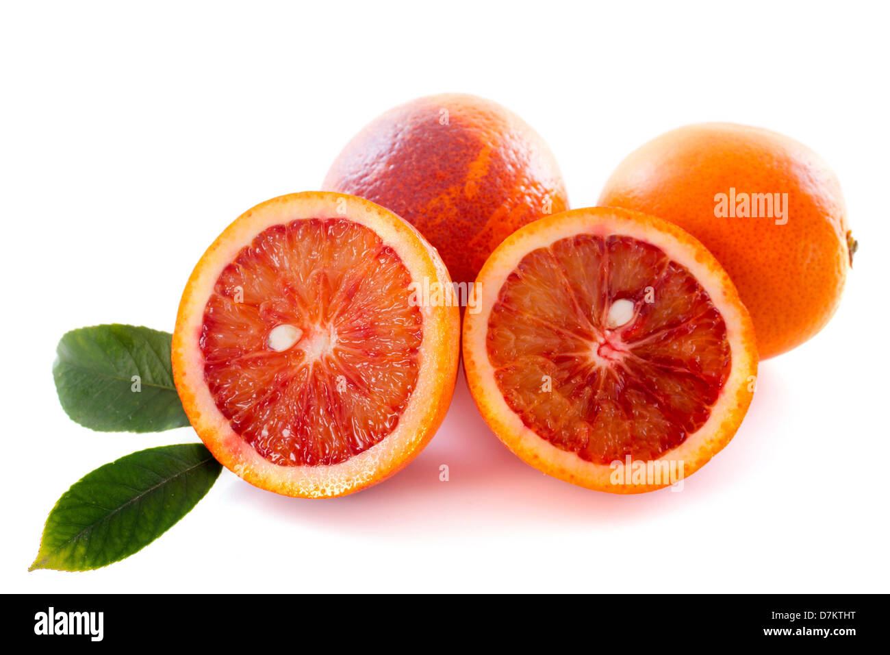 blood oranges in front of white background Stock Photo - Alamy