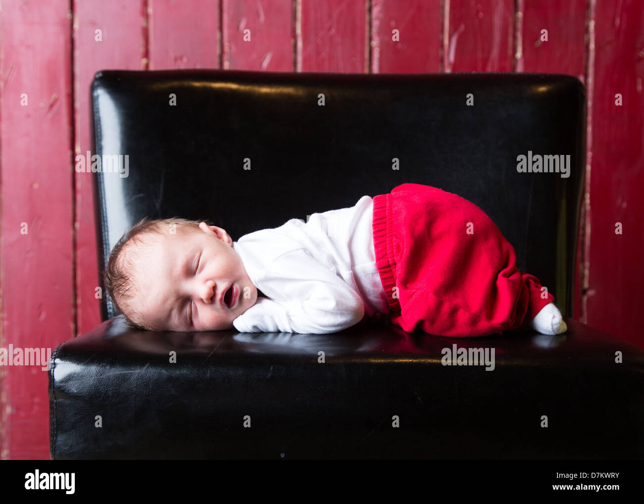 Baby sleeping on chair 2 Stock Photo - Alamy