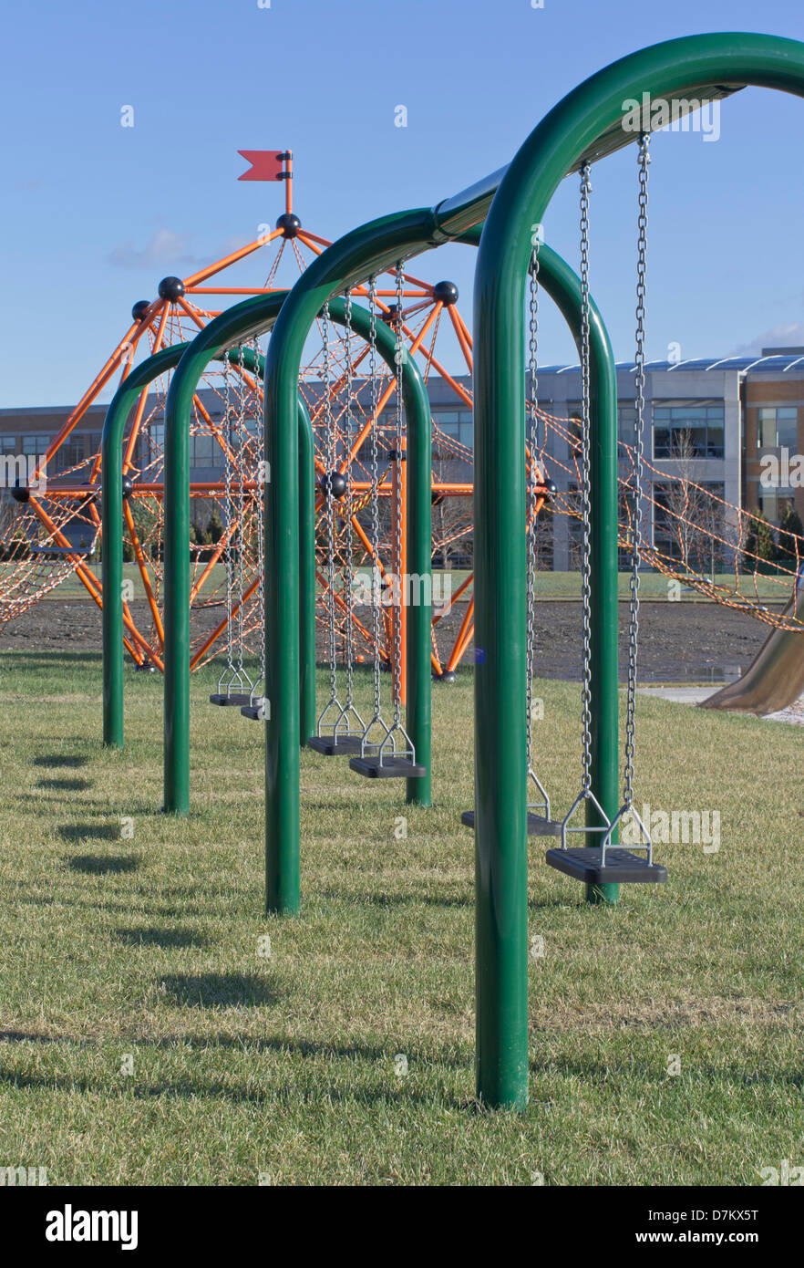 Outdoor play area with swings and climbing structure Stock Photo - Alamy