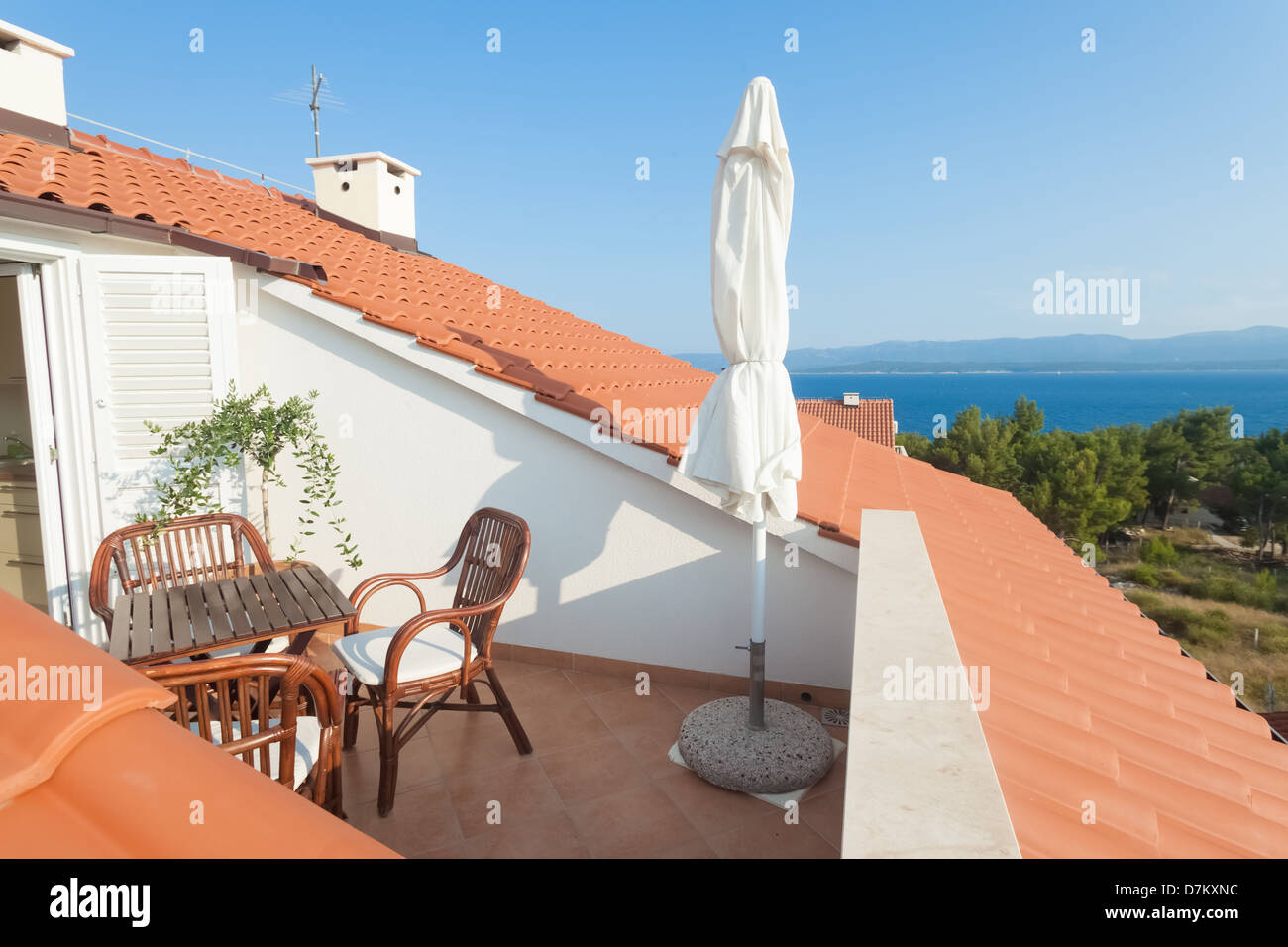 Rooftop terrace with view over sea Stock Photo - Alamy