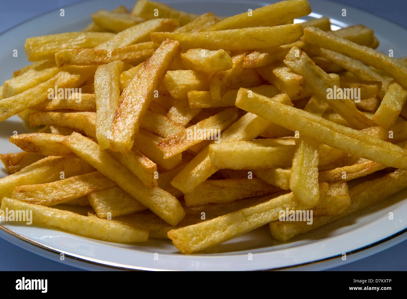 Delicious golden French fries on a white background Stock Photo - Alamy