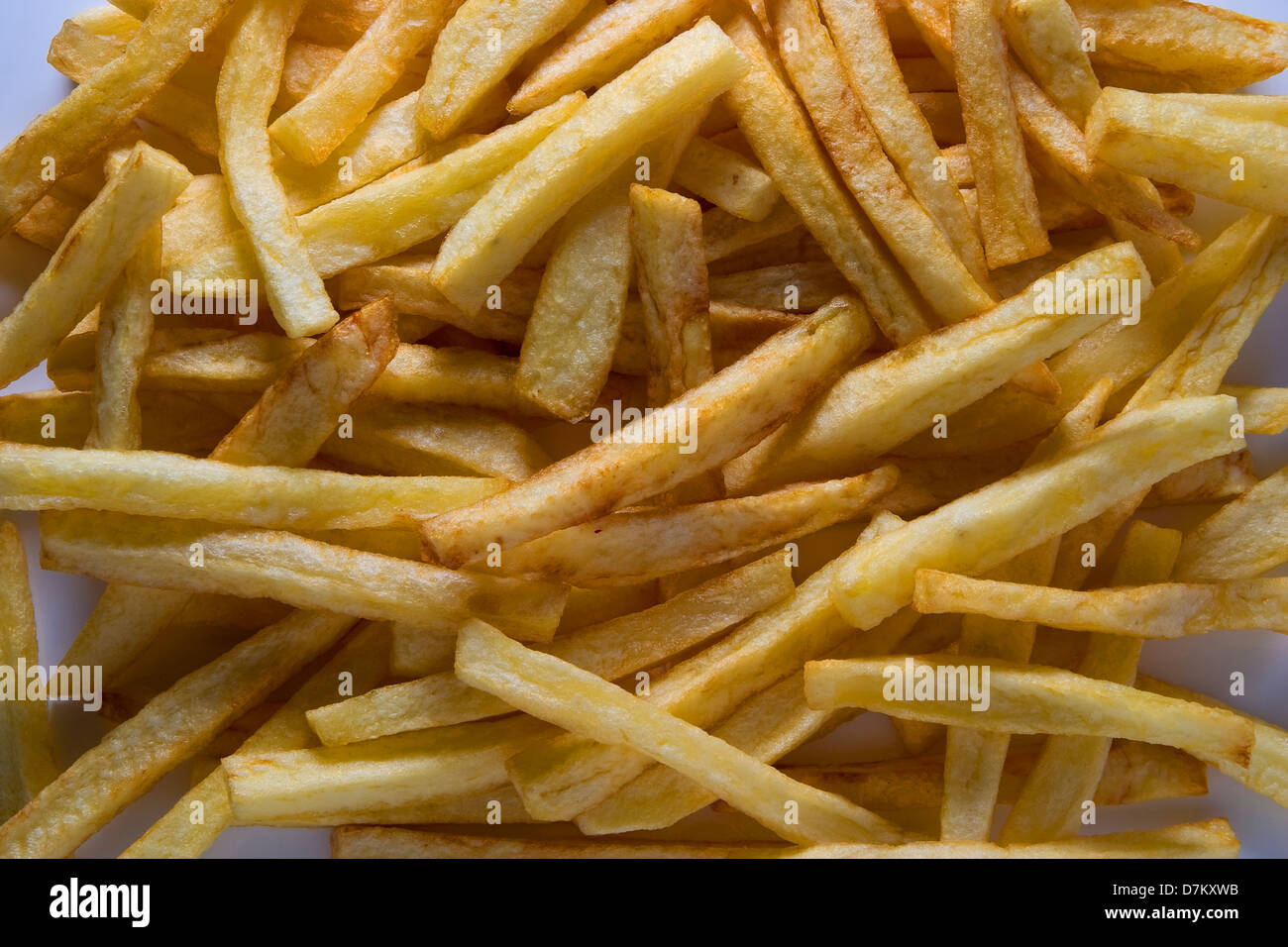 Delicious golden French fries on a white background Stock Photo - Alamy