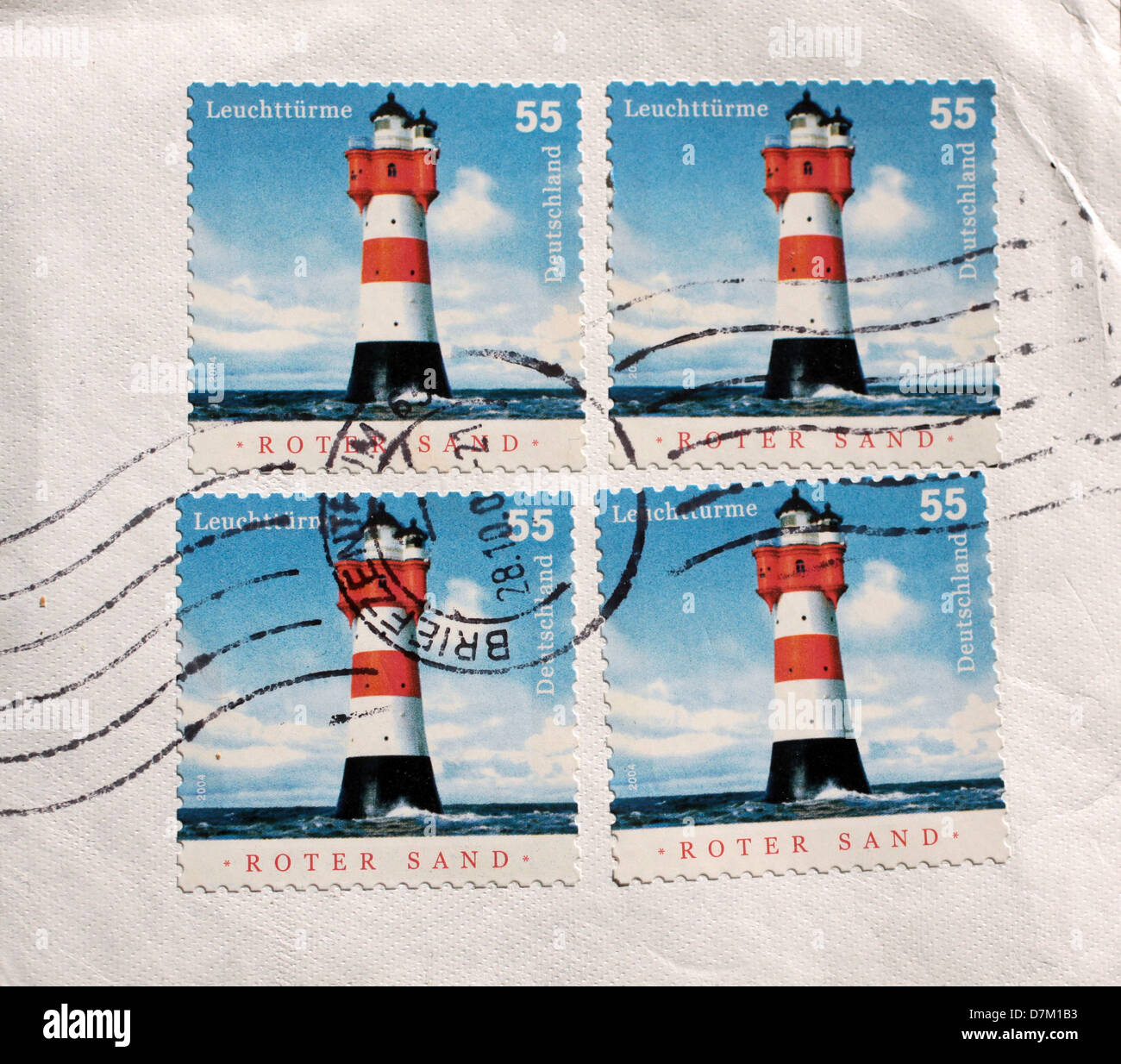 Four used postage stamps lighthouse from Germany Stock Photo - Alamy