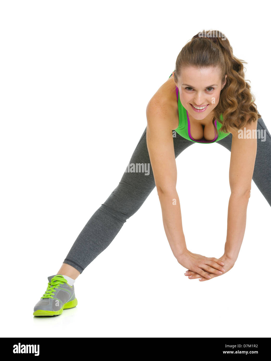 Happy fitness young woman stretching Stock Photo - Alamy