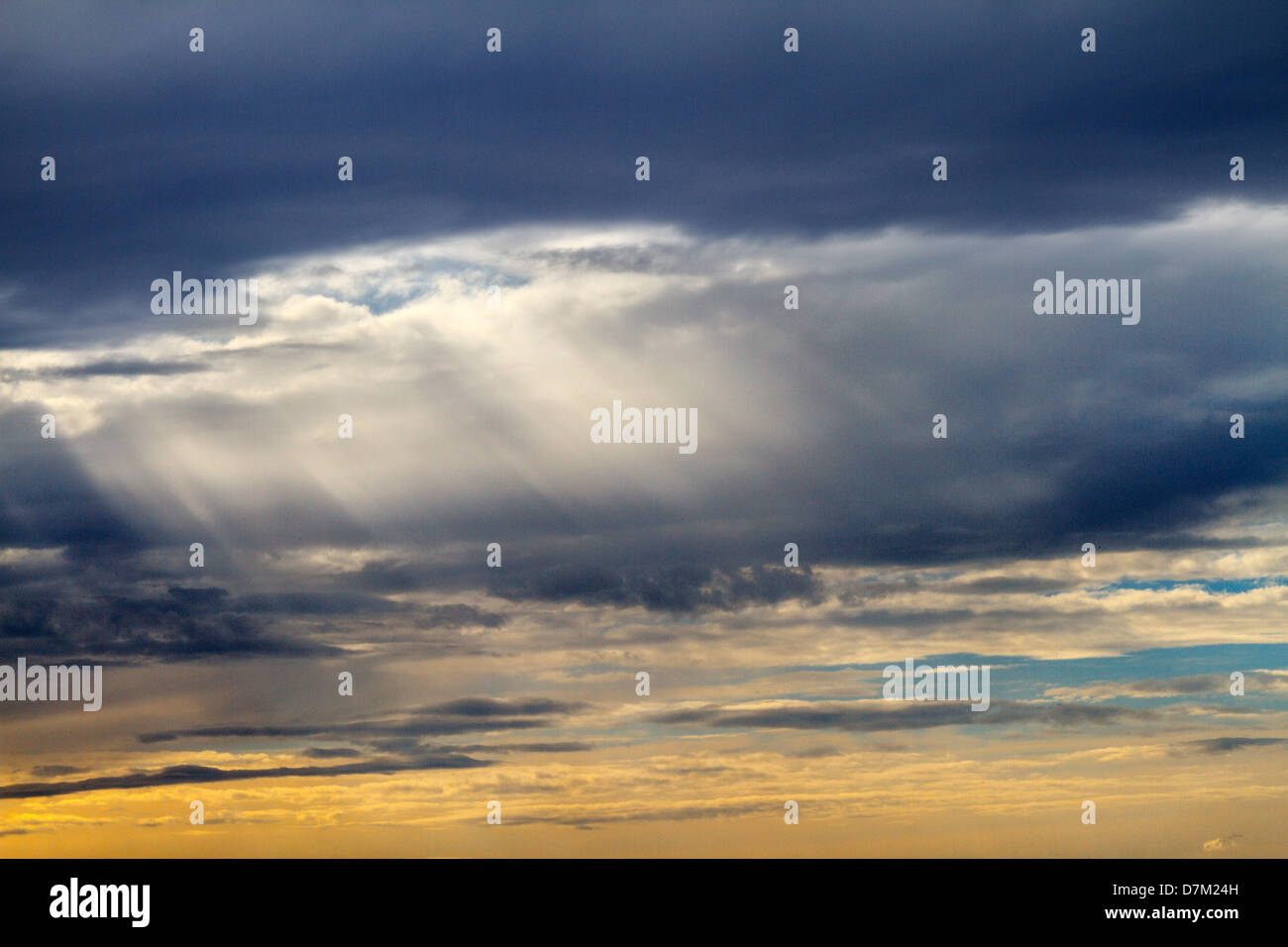 Blue and Orange sky with sun rays Stock Photo - Alamy
