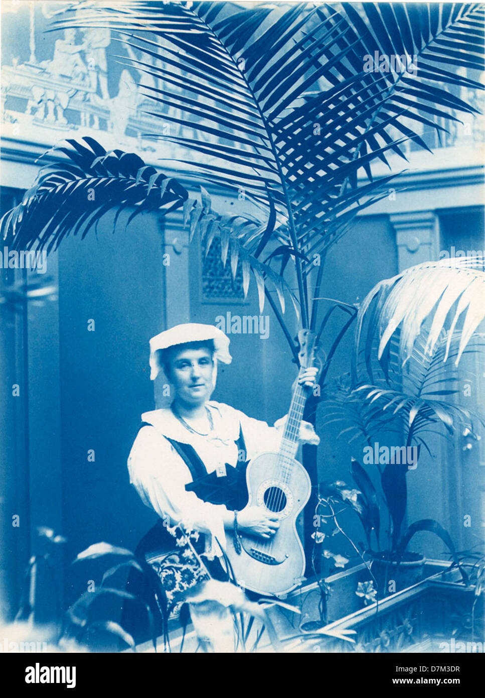 Calla Curman, a prominent Swedish figure, is photographed with a guitar ...