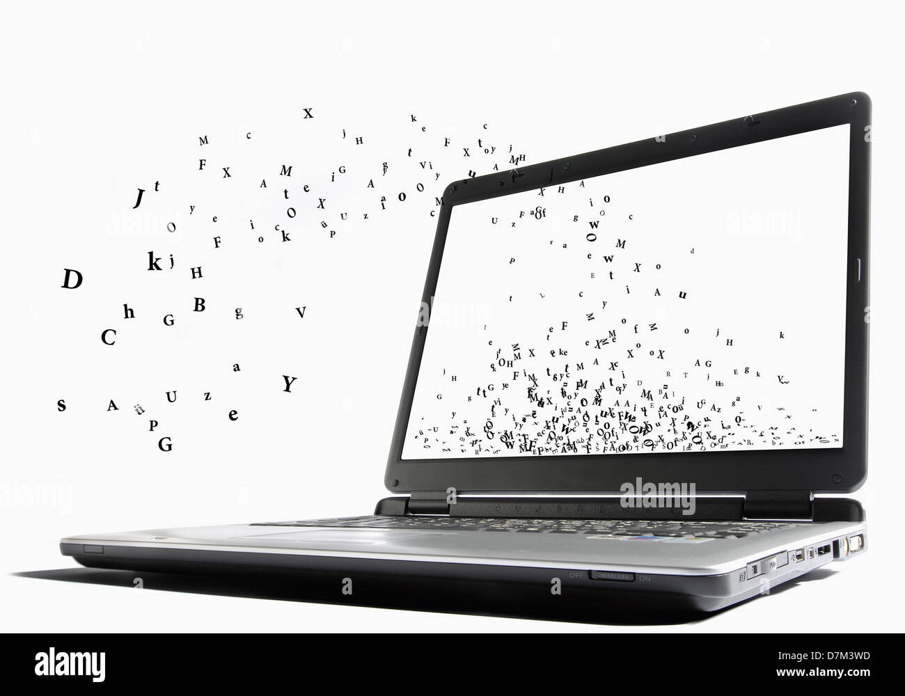 Laptop with flying alphabets, close up Stock Photo - Alamy