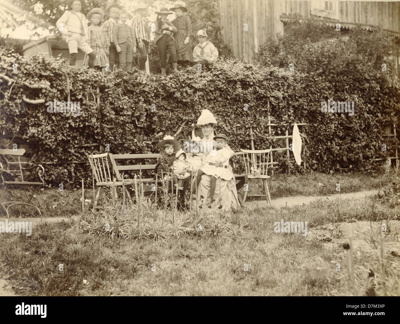 A sepia-toned photograph by Carl Curman showing a woman and children in ...