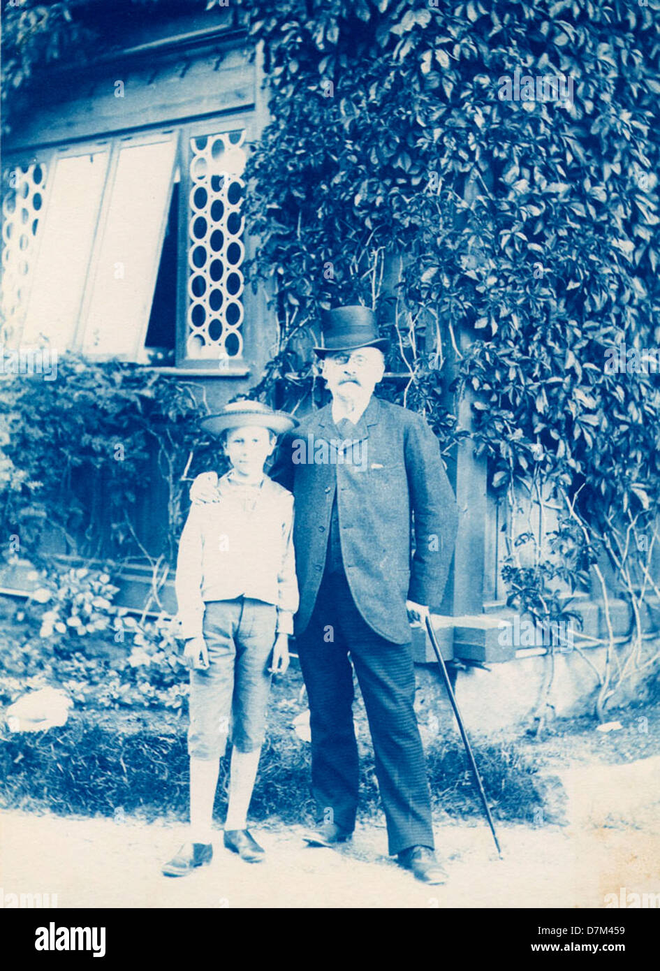 This photograph captures a boy and a man standing outside one of Carl ...