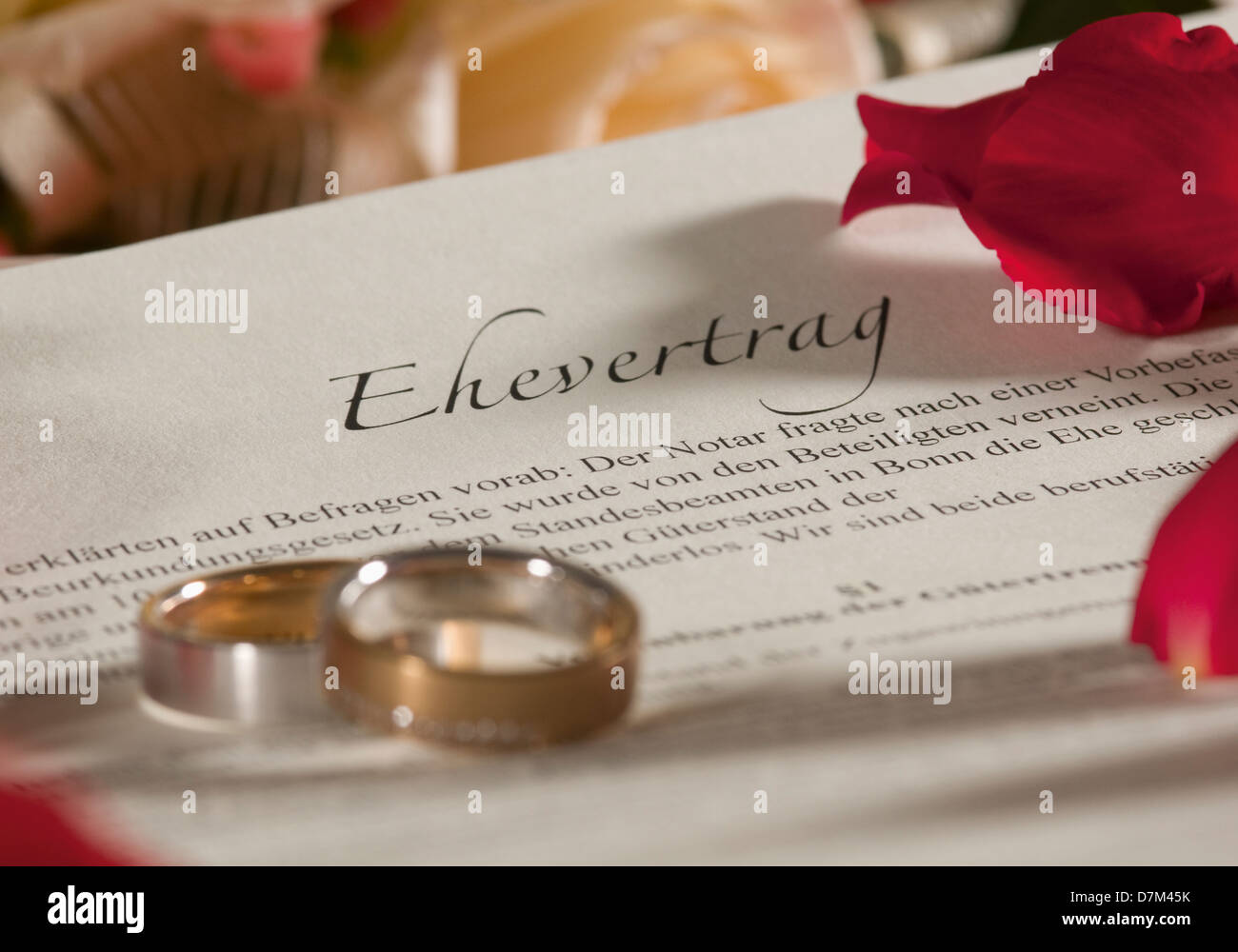Wedding rings on invitation card, close up Stock Photo - Alamy