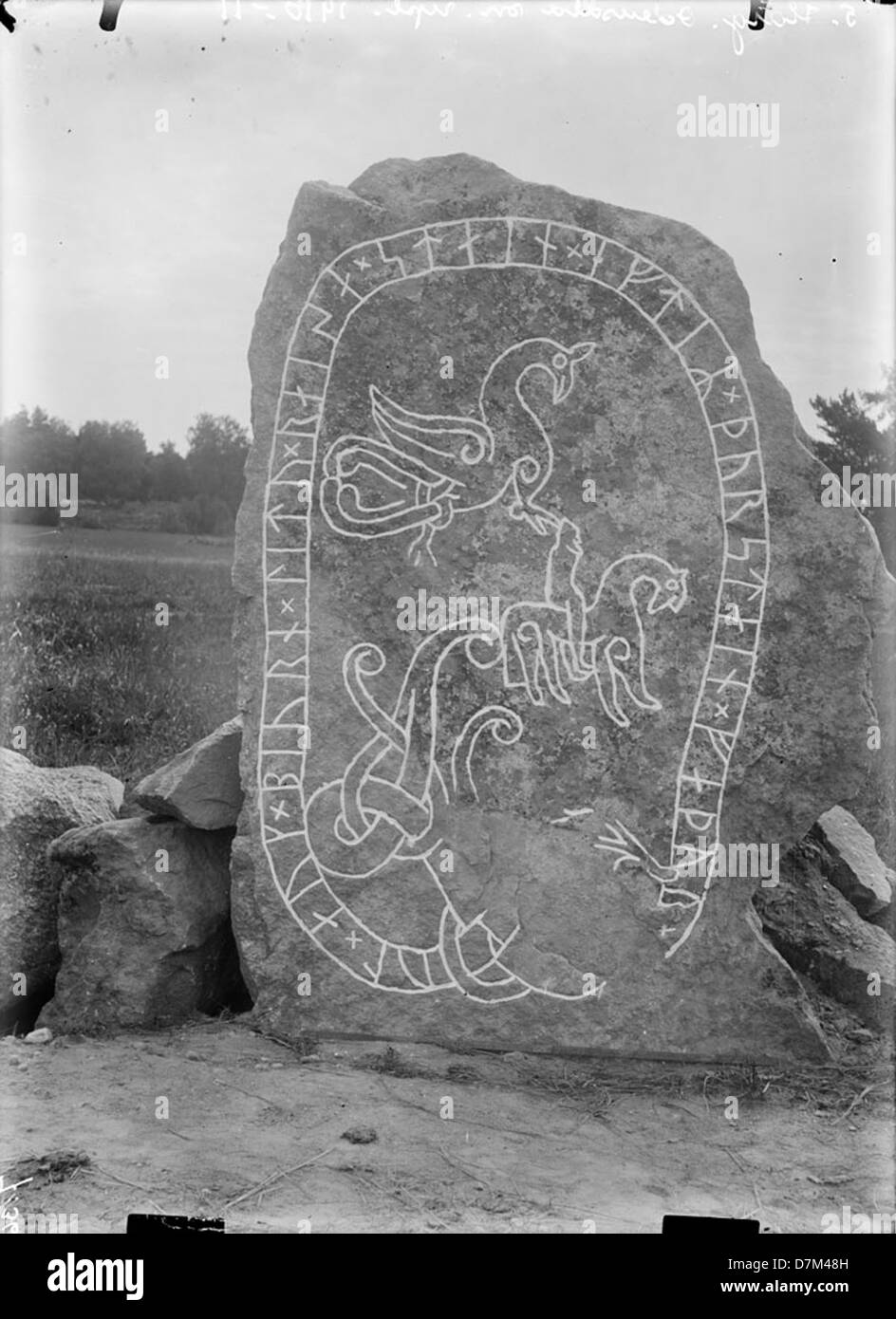 This photograph shows the rune stone at Harg, Uppland, Sweden. The ...