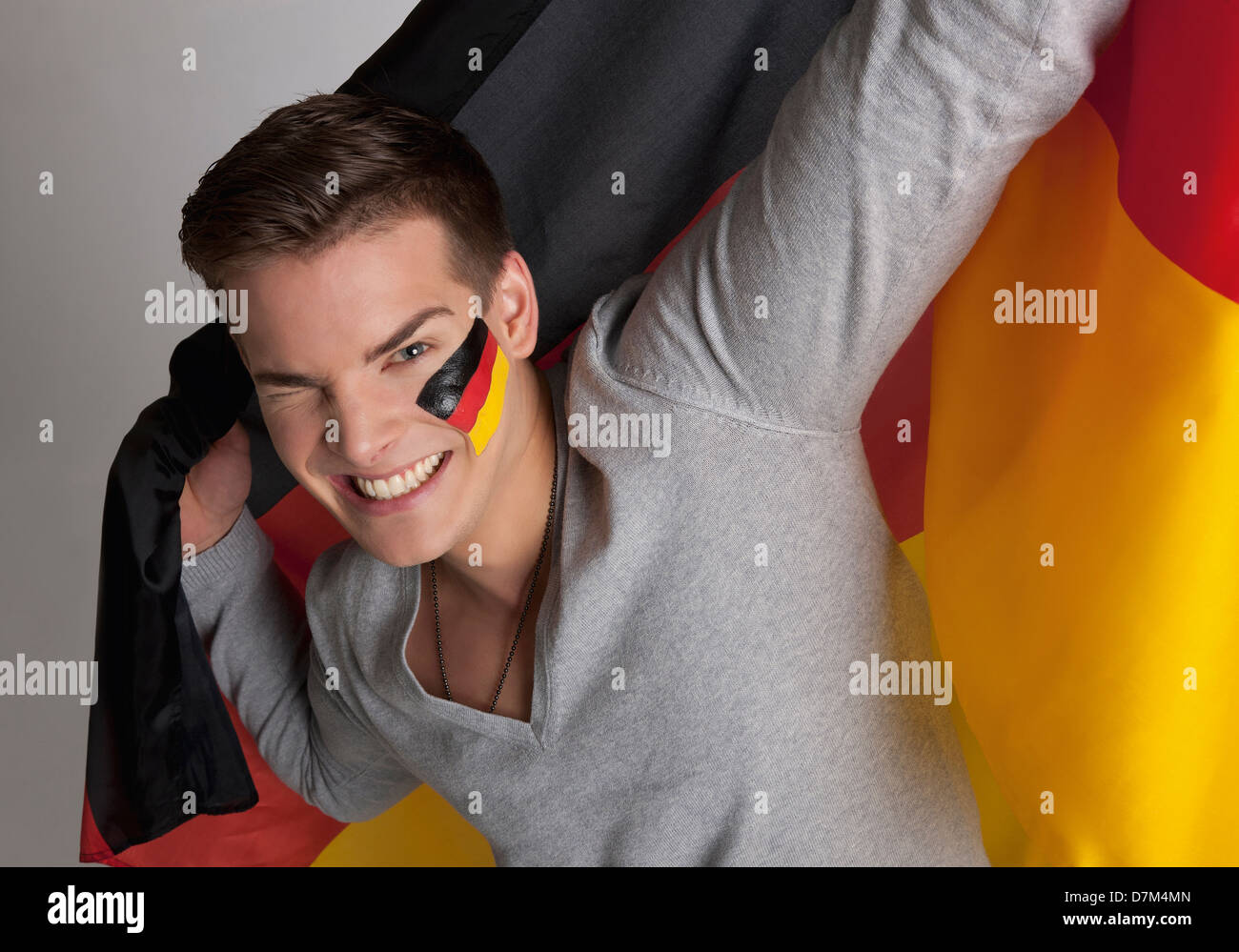 Young man with German flag, close up Stock Photo - Alamy