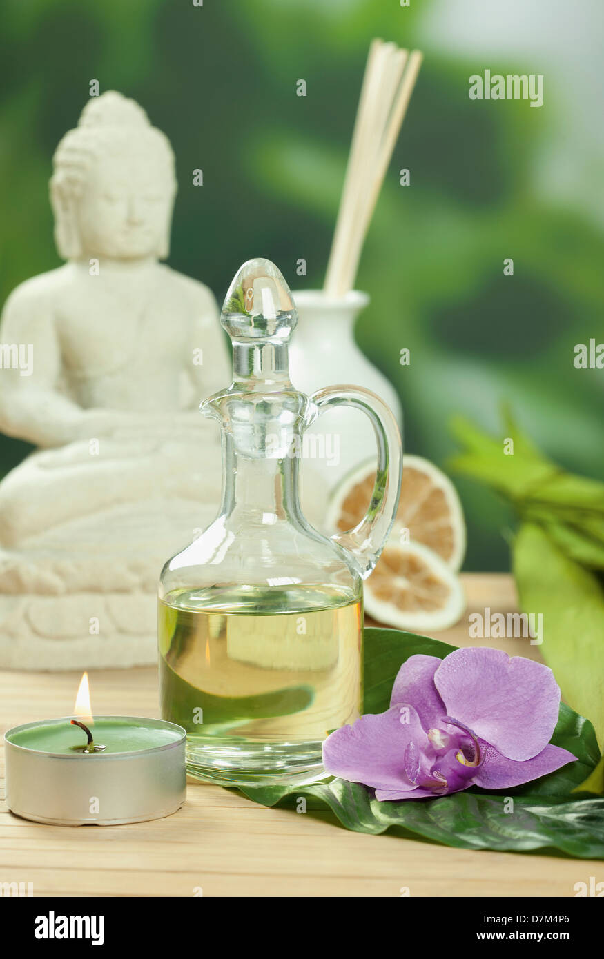 Arrangement of spa products with buddha statue Stock Photo - Alamy