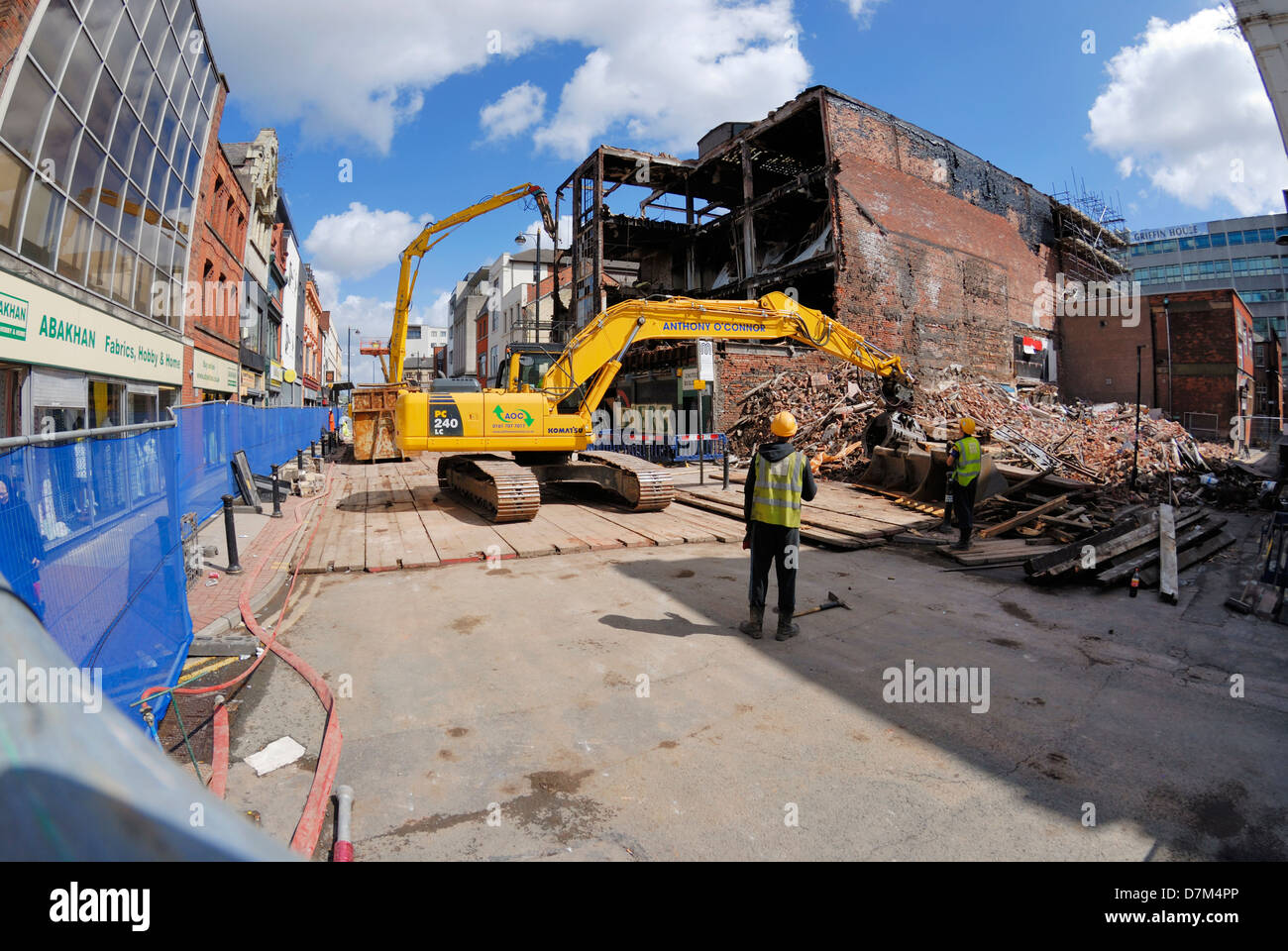 Demolition of a building damaged by fire in Oldham Street, Manchester ...