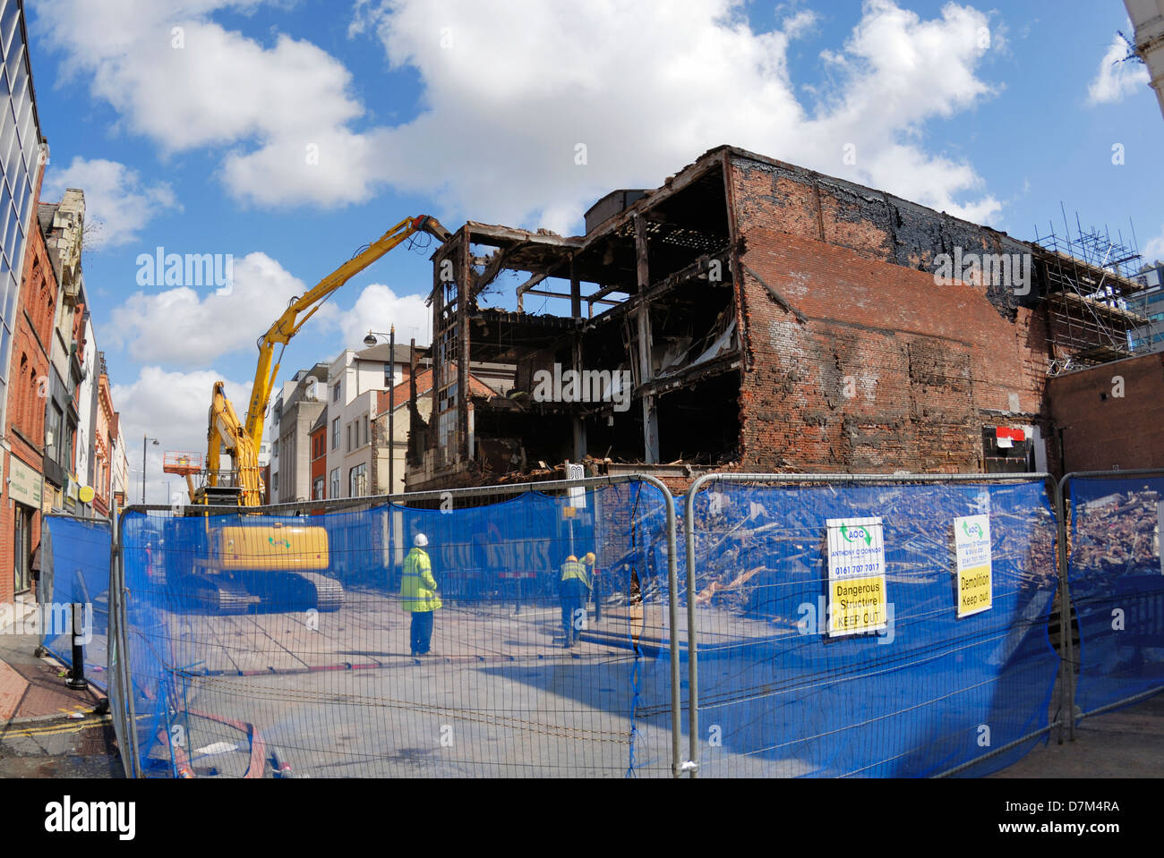 Demolition of a building damaged by fire in Oldham Street, Manchester ...