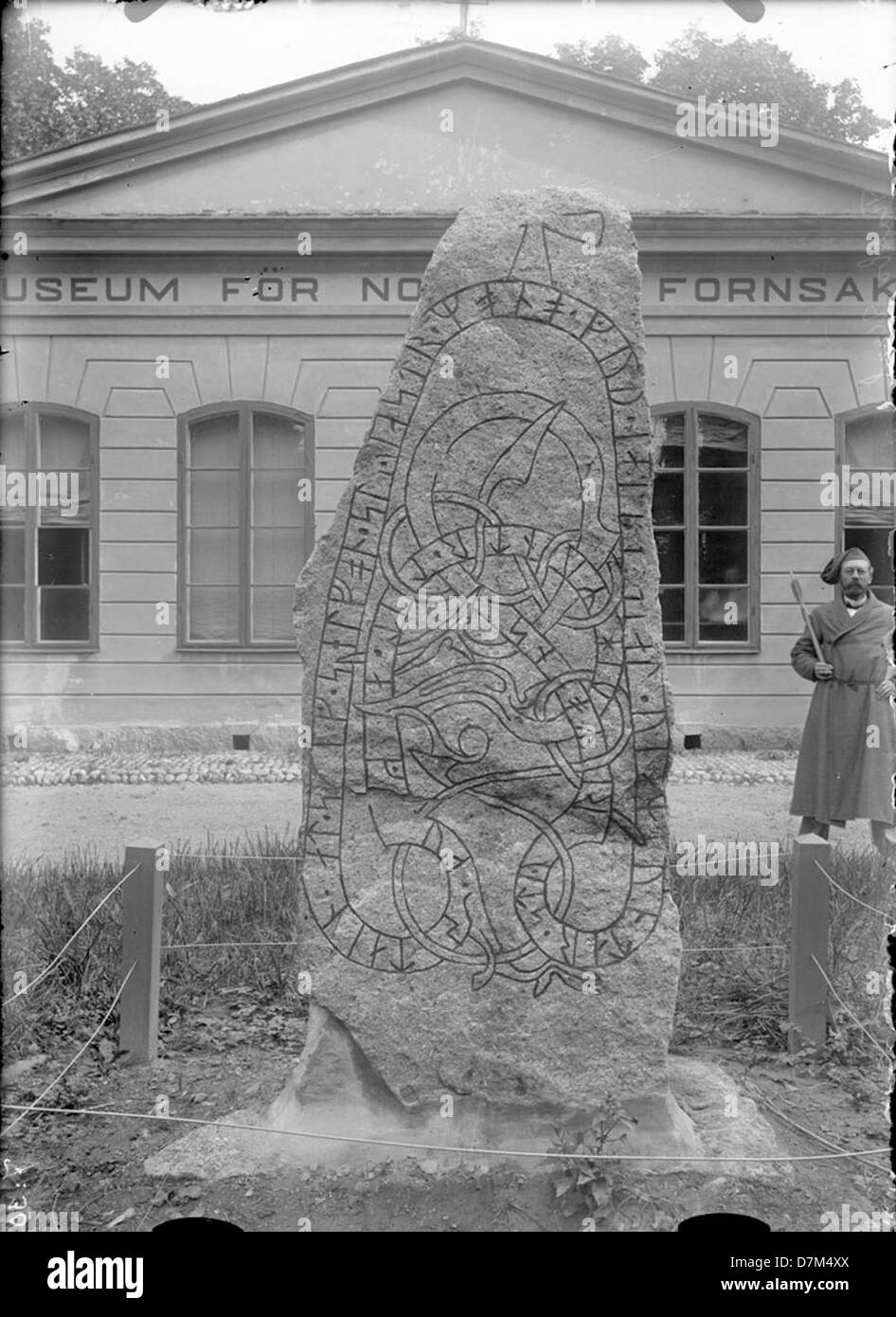 A rune stone stands outside a museum in Uppsala, Uppland, Sweden. These ...