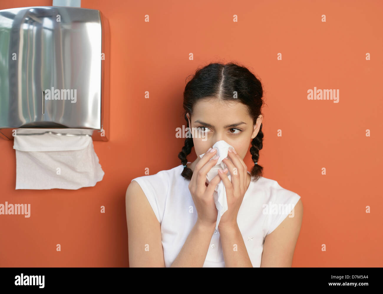 Young woman sneezing on Cut Out Stock Images & Pictures - Alamy