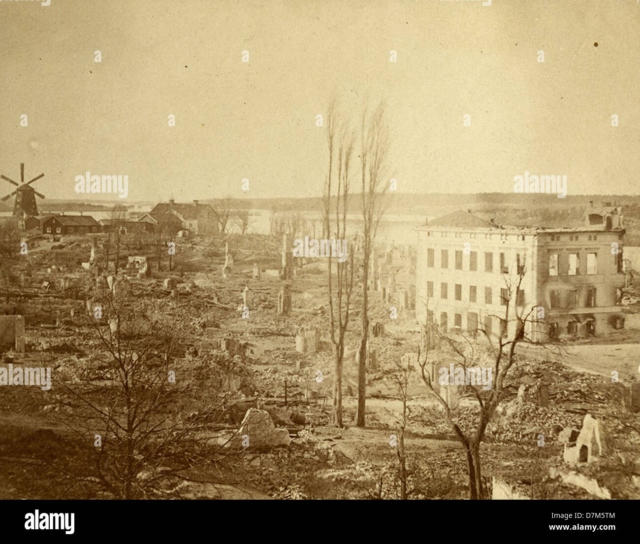This historical photograph captures the devastation caused by a fire in ...