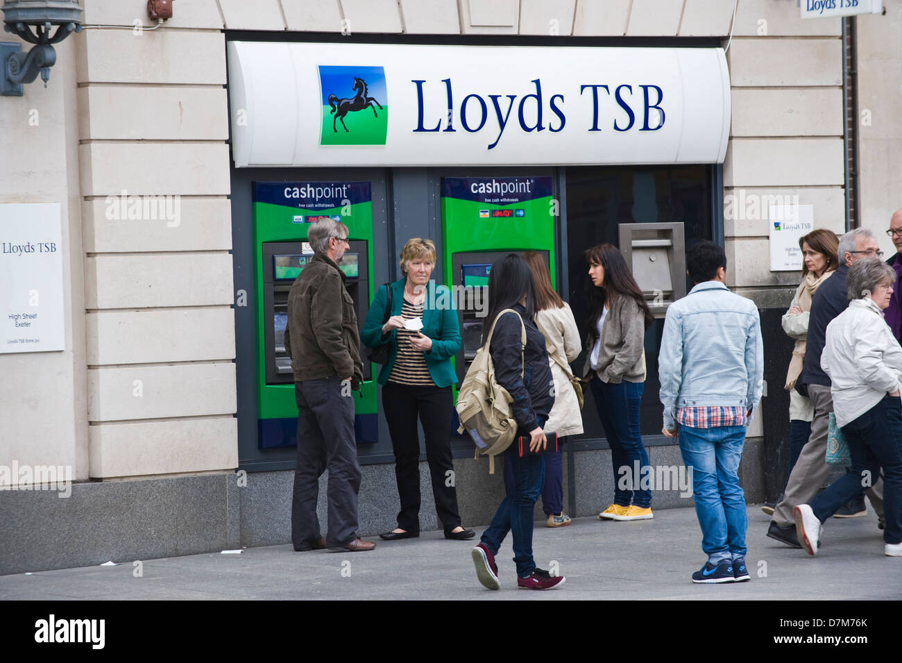 Queue at LLOYDS TSB cashpoint on high street in city centre of Exeter ... Queue at LLOYDS TSB cashpoint on high street in city centre of Exeter ...