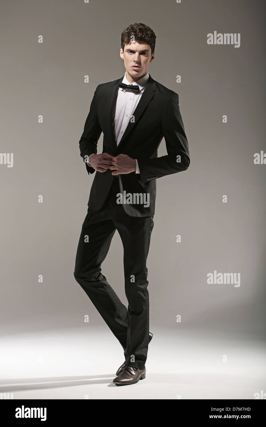 Smart young man in fashion pose Stock Photo - Alamy
