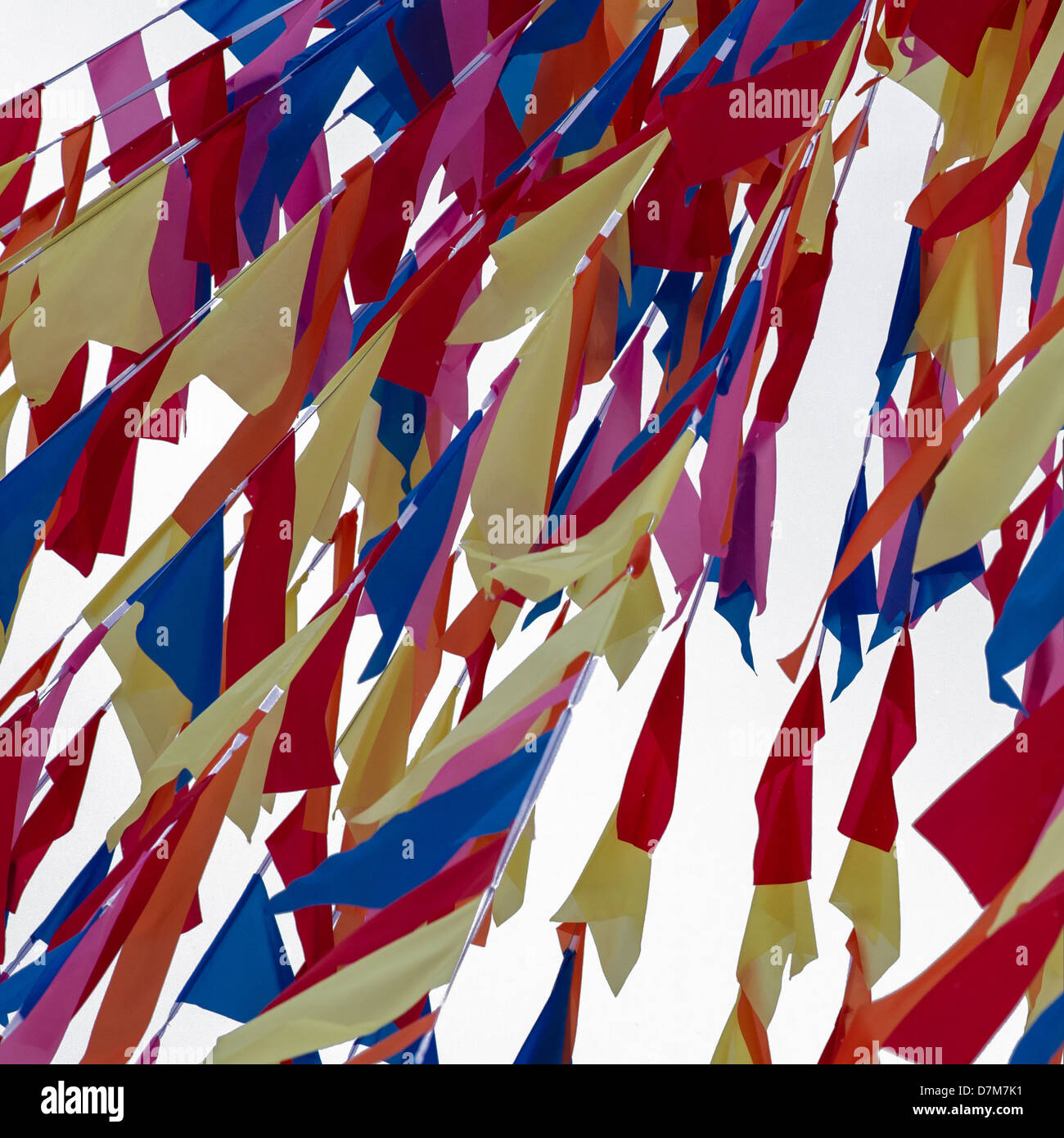 Colorful flags fixed to ropes, isolated Stock Photo - Alamy