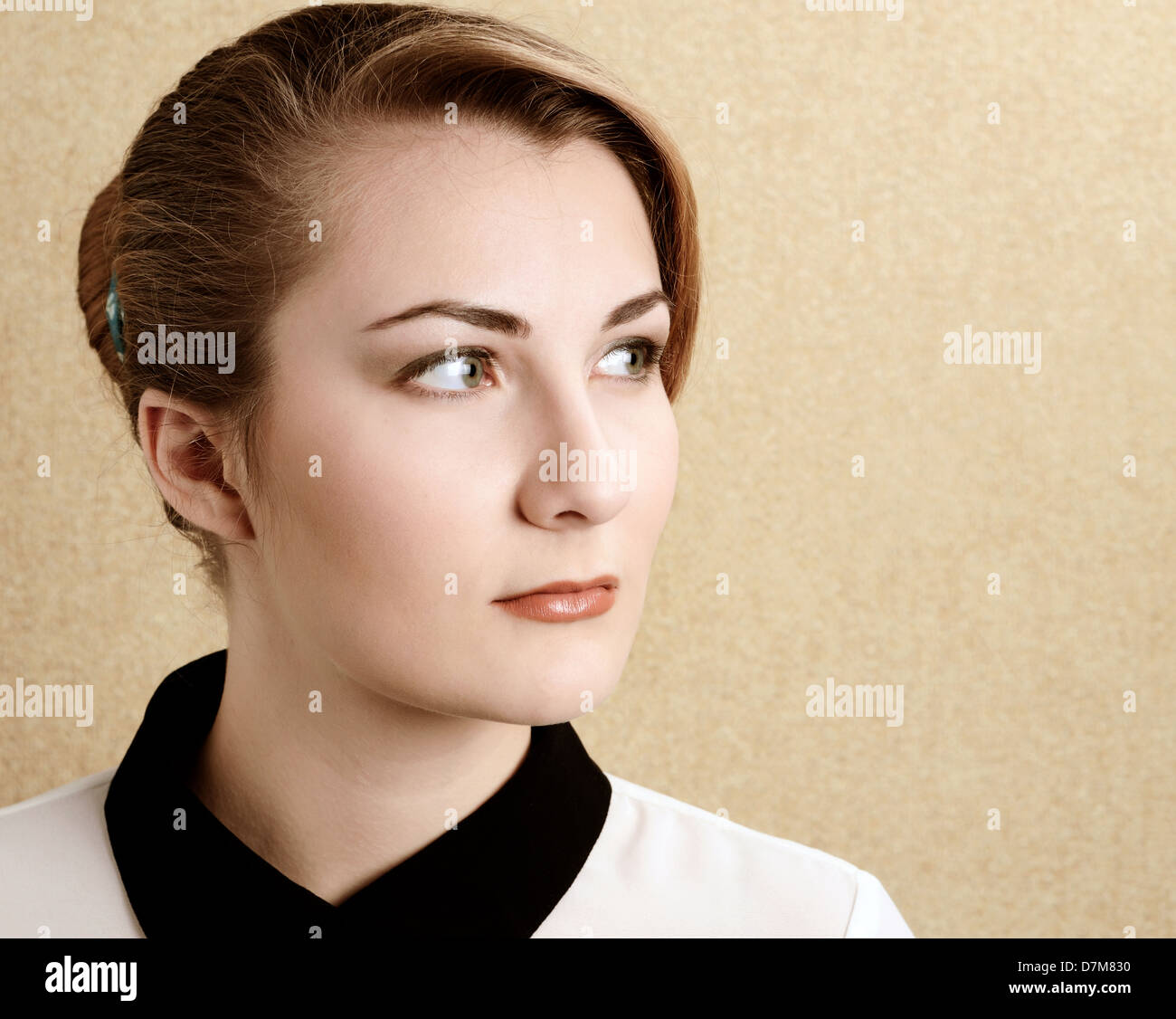 Confident woman looking right against uniform background Stock Photo ...