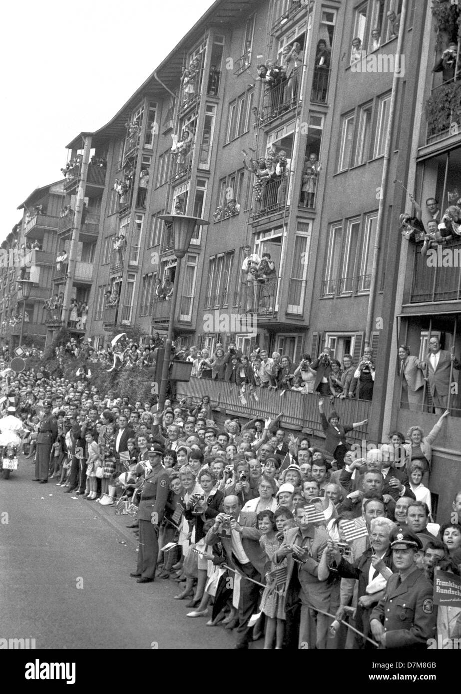 Cheering crowd at the roadside. After visiting a NATO military parade ...