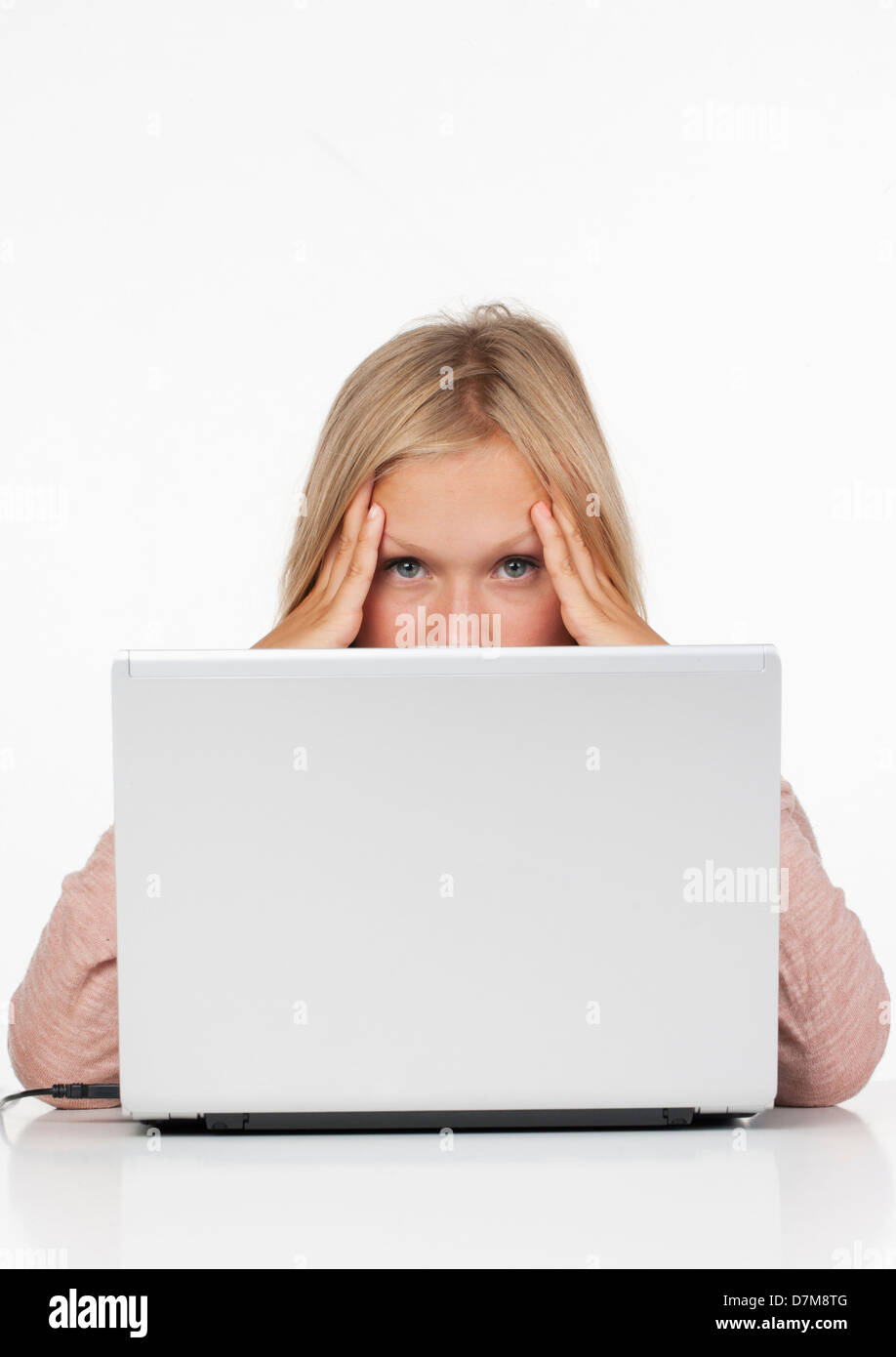 Frustrated teenage girl using laptop, close up Stock Photo - Alamy