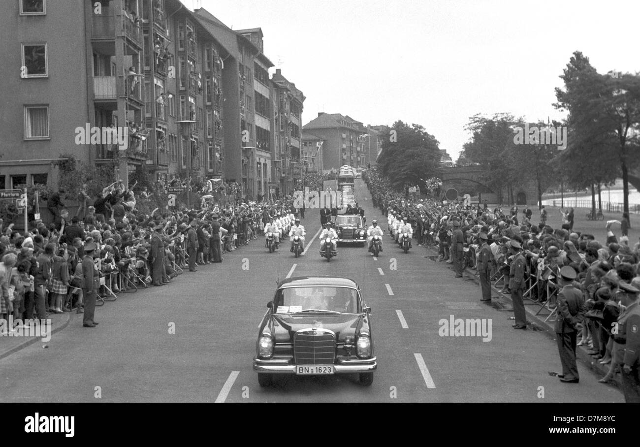 Cheering crowd at the roadside. After visiting a NATO military parade ...